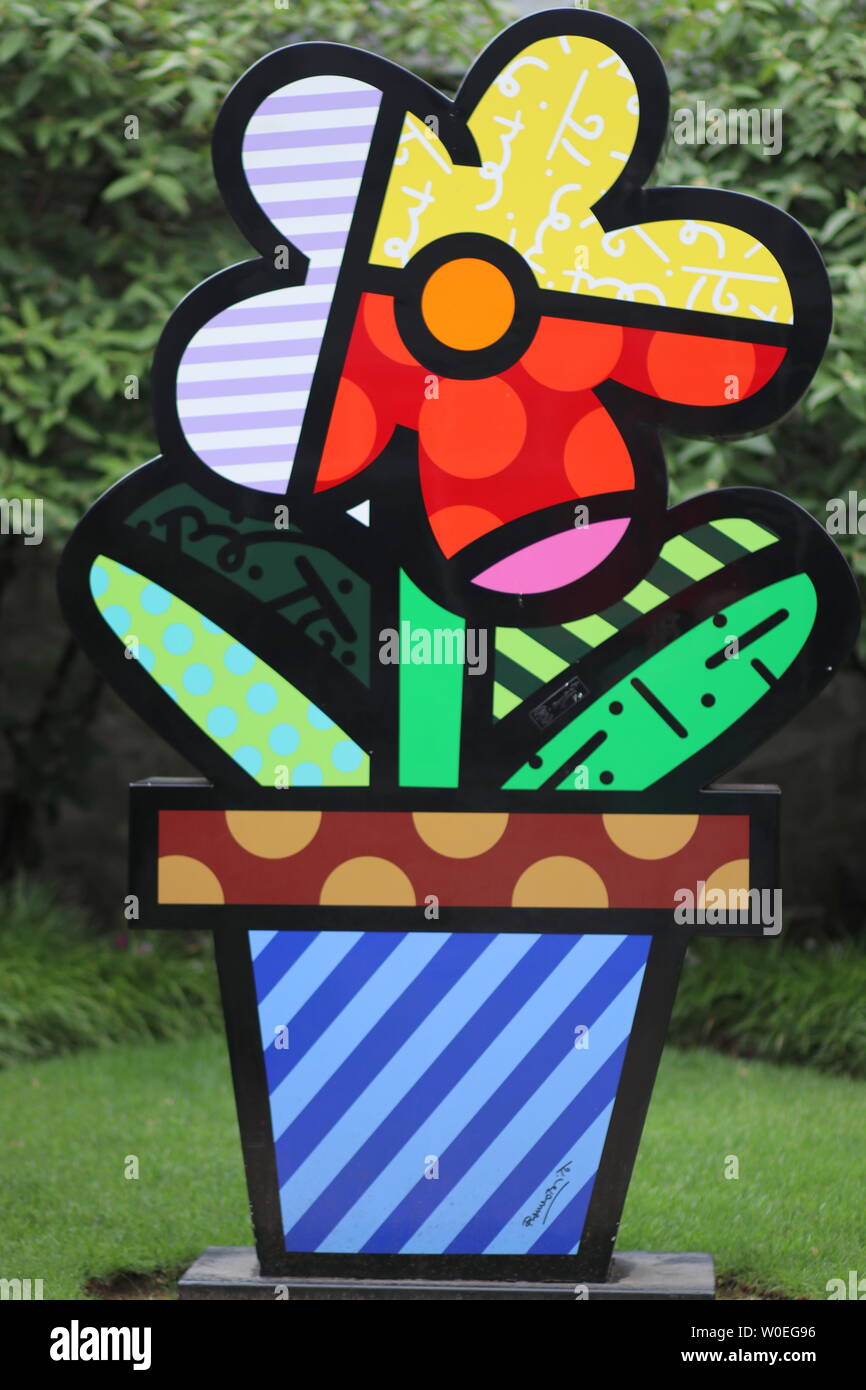 The colorful design of a flower and pot Stock Photo - Alamy