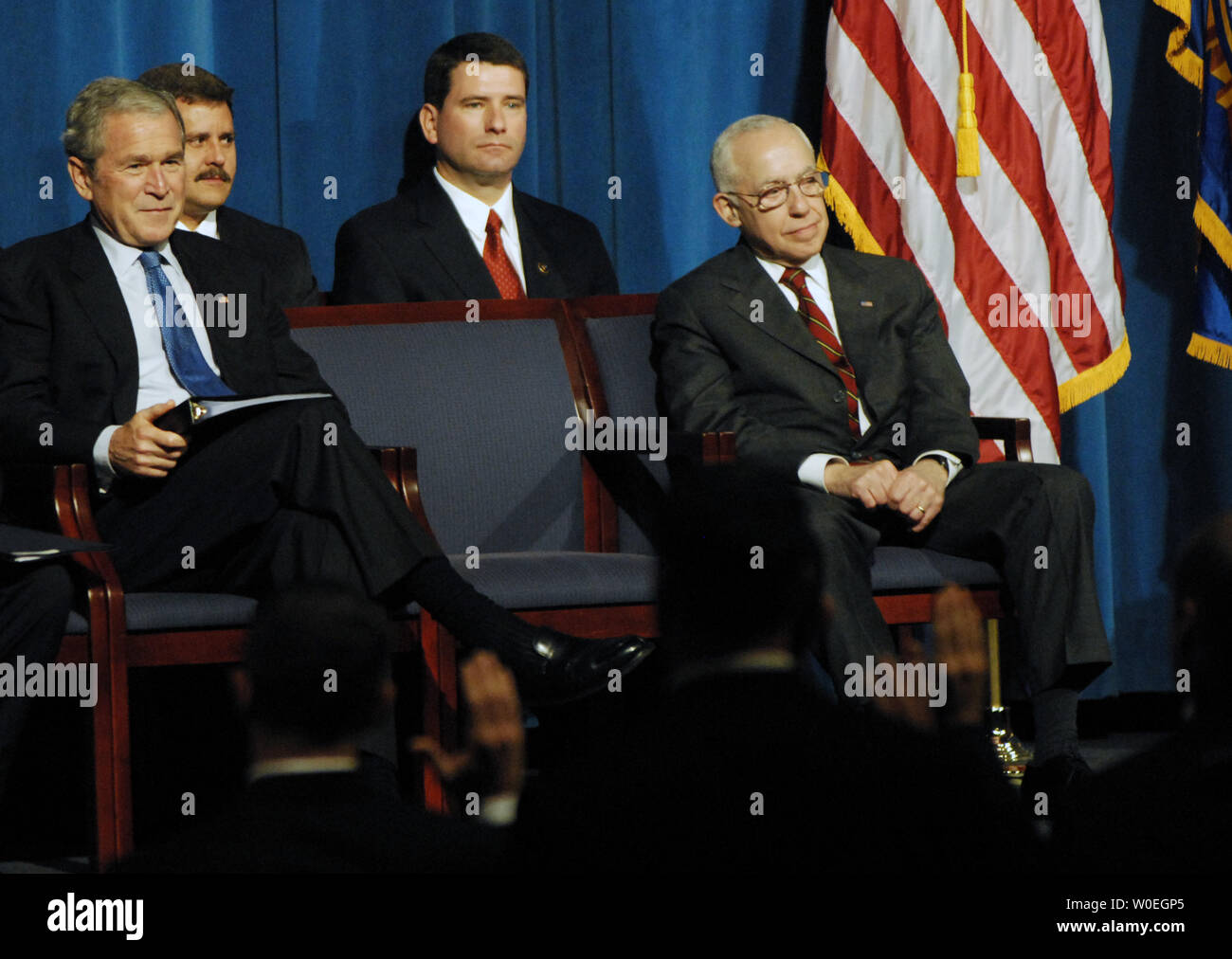 U.S. President George W. Bush (L) and U.S. Attorney General Michael ...
