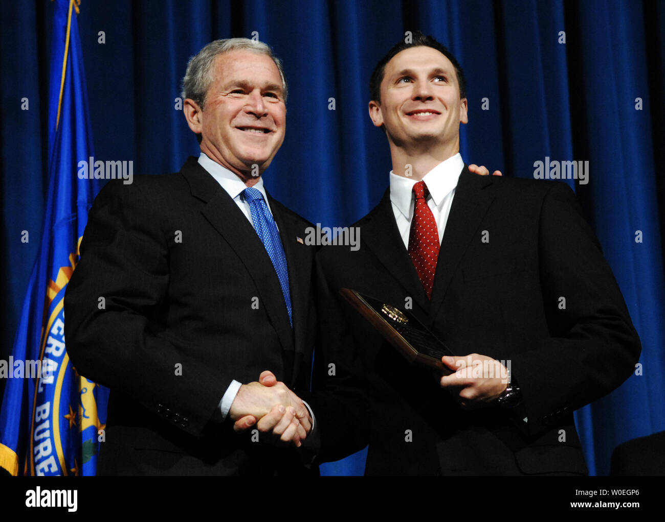 U.S. President George W. Bush (L) congratulates Richard Brooks after he ...