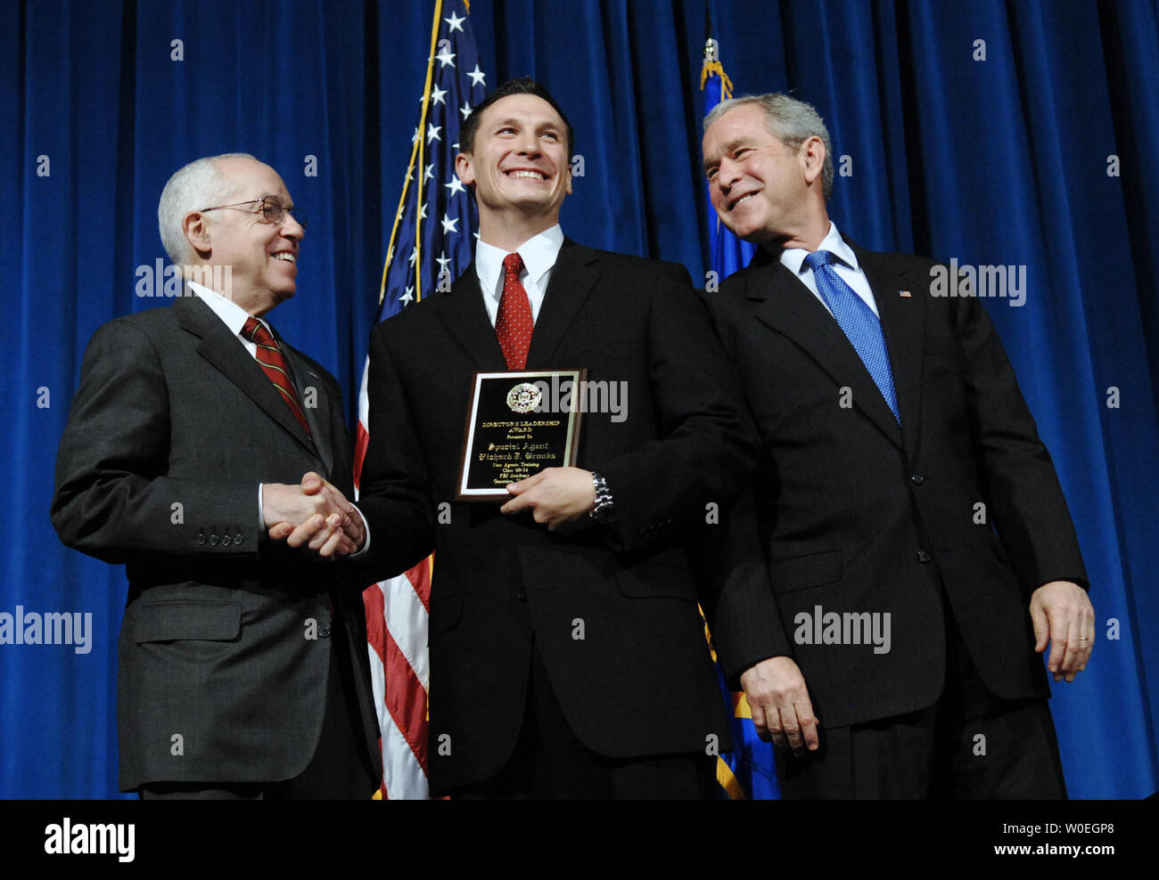 U.S. President George W. Bush (R) and U.S. Attorney General Michael ...