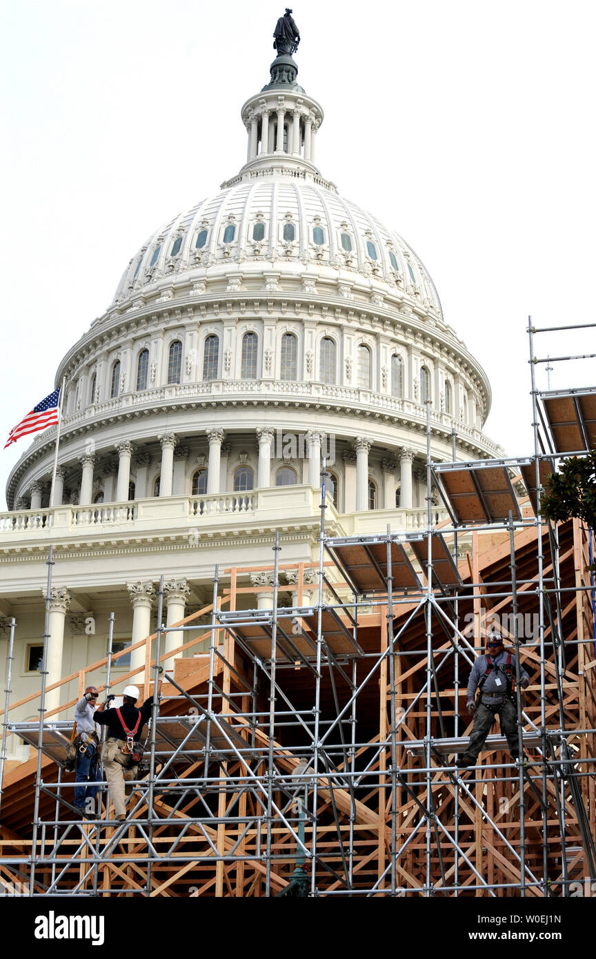 Workers construct inaugural platforms on the west steps of the U.S ...