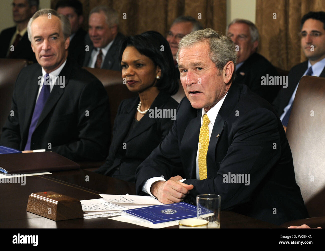President George W. Bush (R), seated next to Secretary of State ...