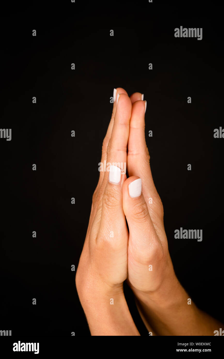 Female hands in a praying gesture, a concept Stock Photo - Alamy
