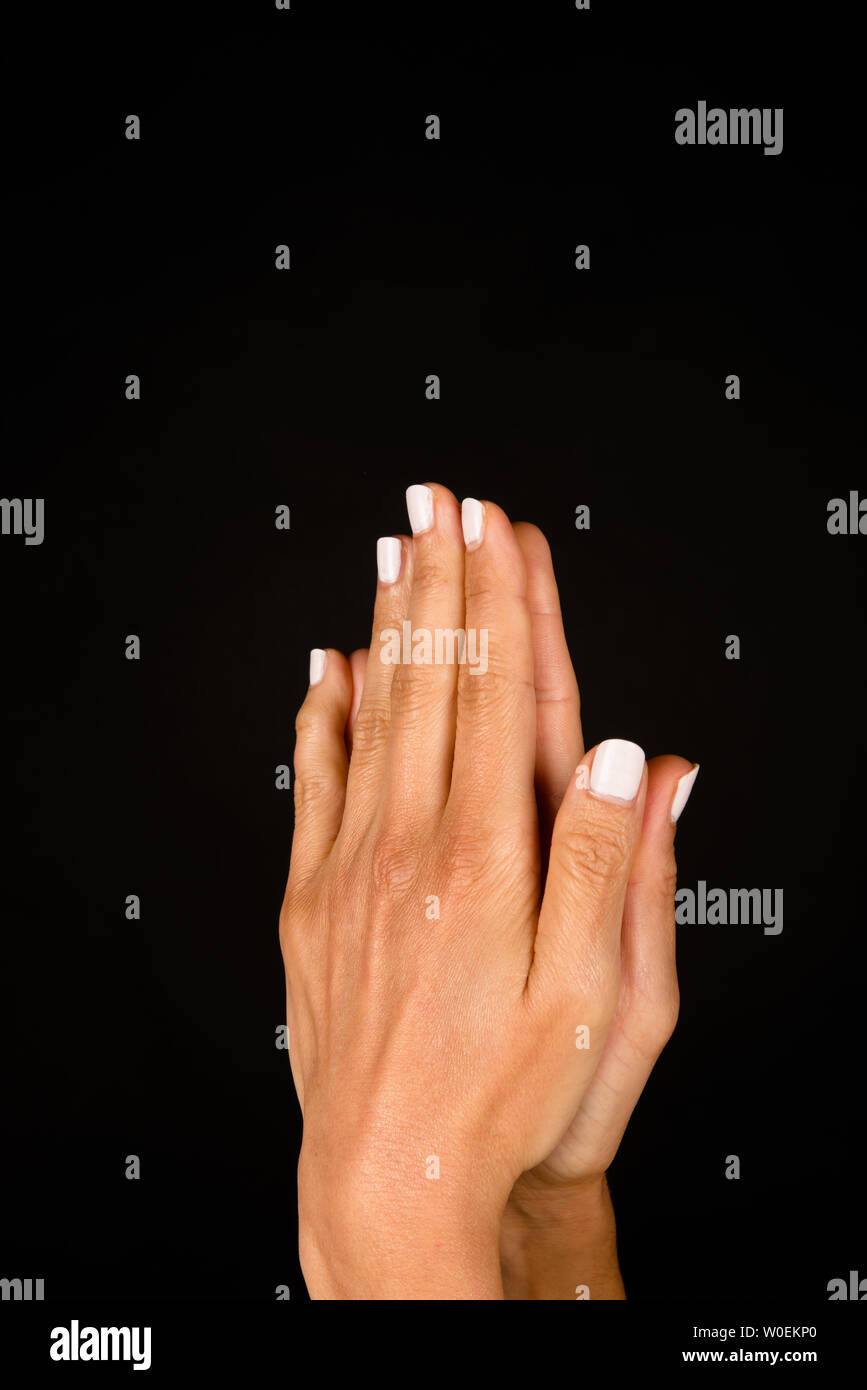 Female hands in a praying gesture, a concept Stock Photo - Alamy