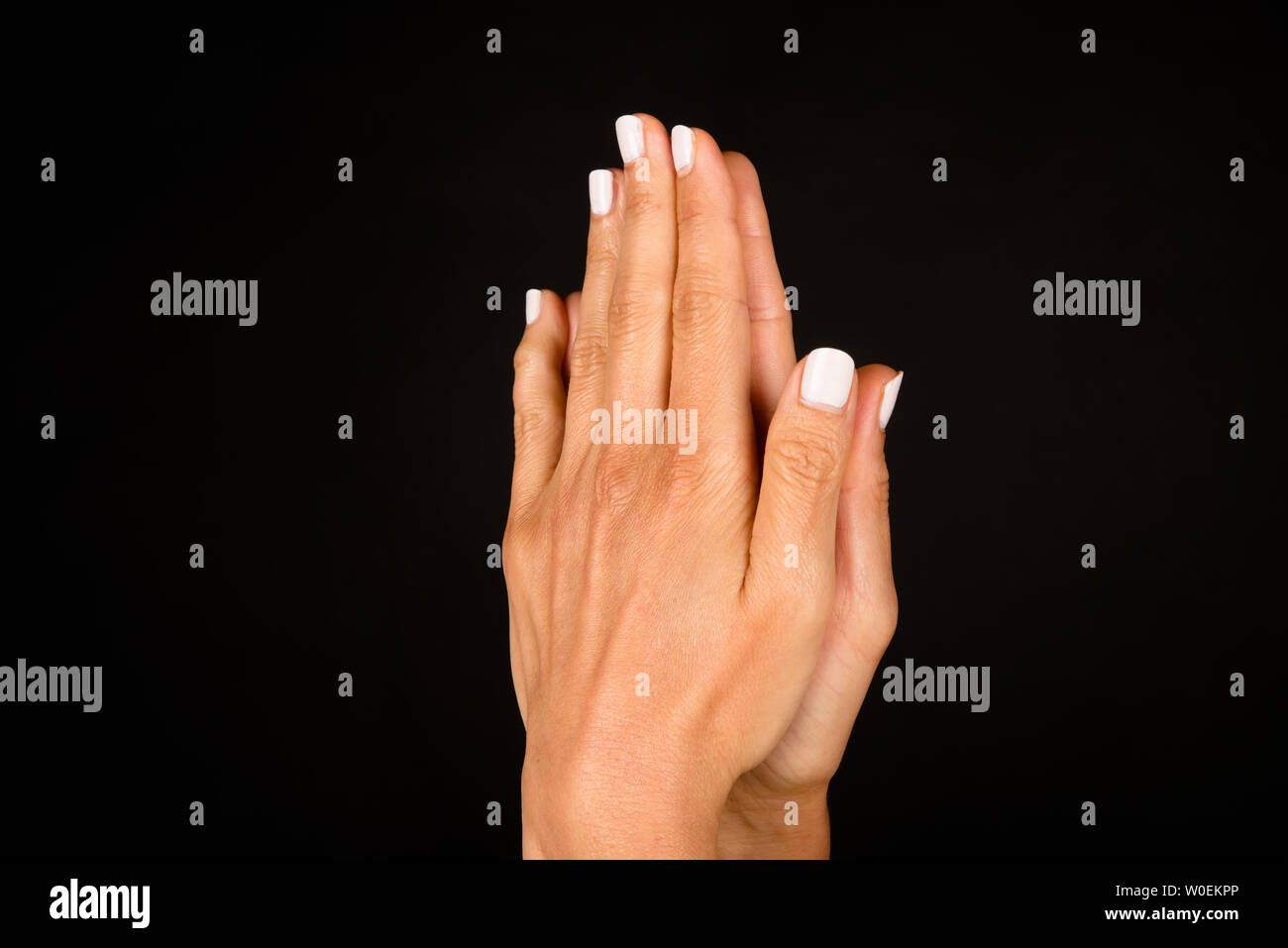 Female hands in a praying gesture, a concept Stock Photo - Alamy