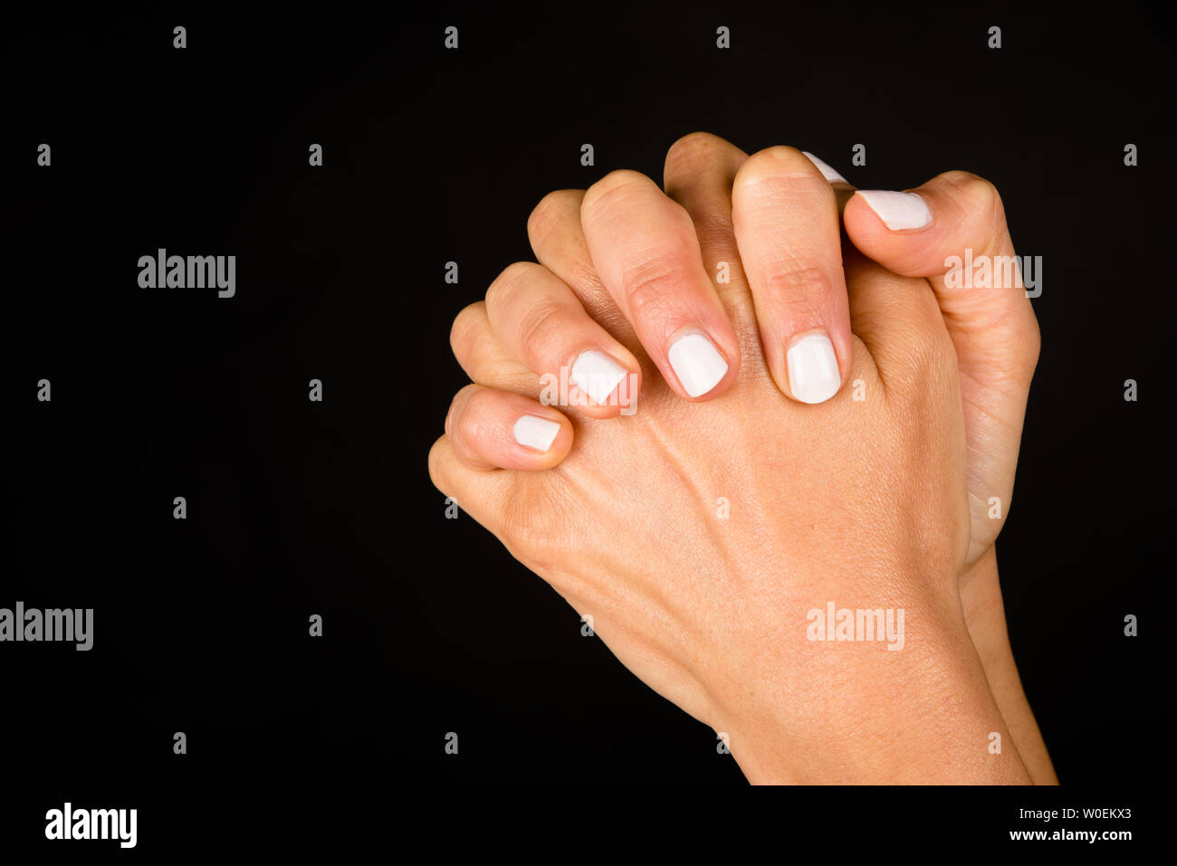 Female hands in a praying gesture, a concept Stock Photo - Alamy
