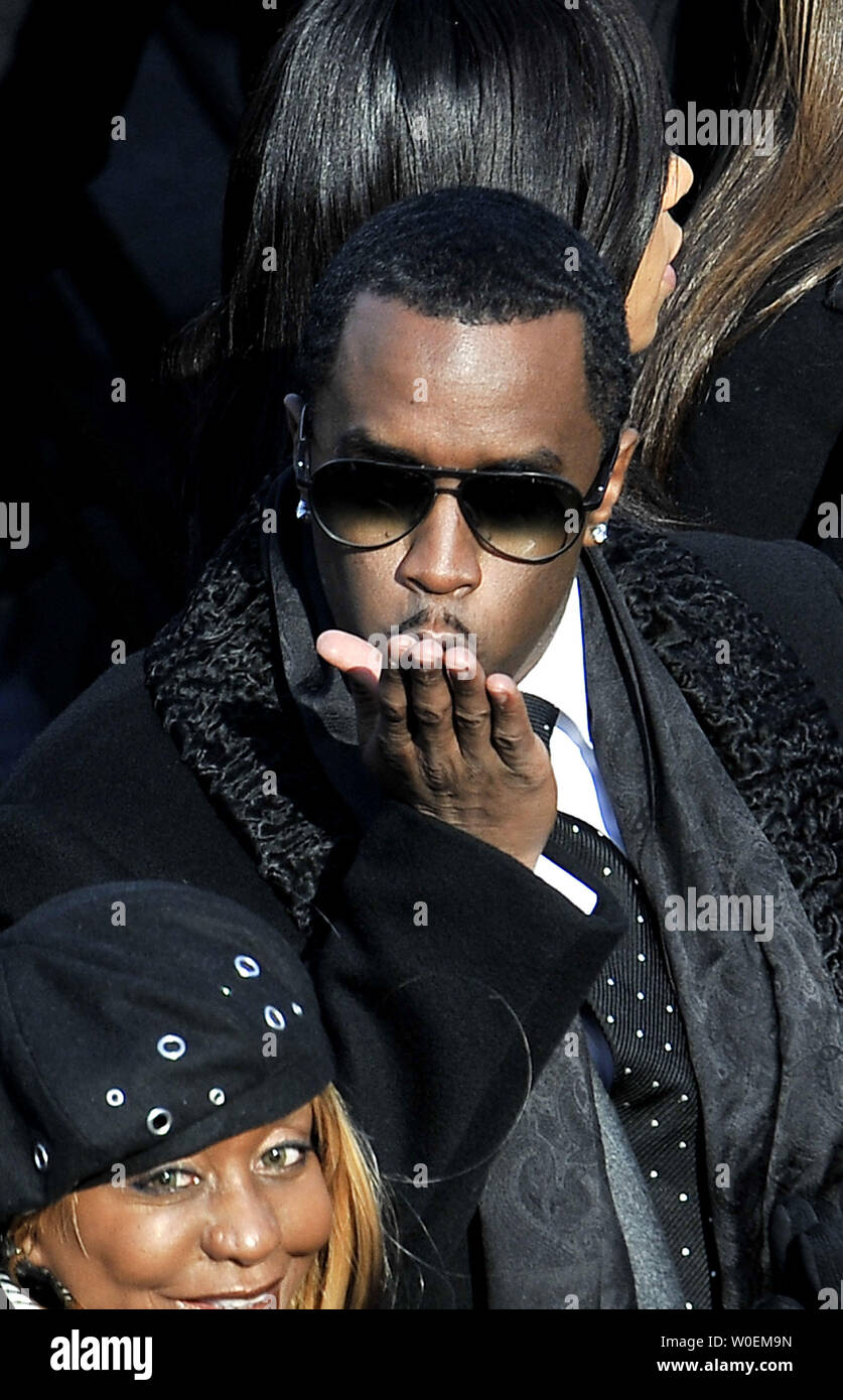 Recording artists Sean "Diddy" Combs blows a kiss as he attends Barack ...