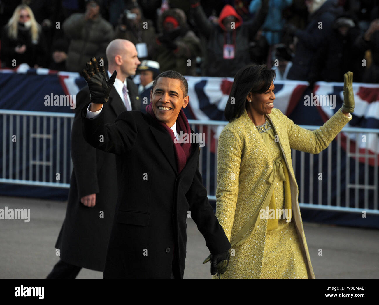 U.S. President Barack Obama walks with First Lady Michelle Obama along ...