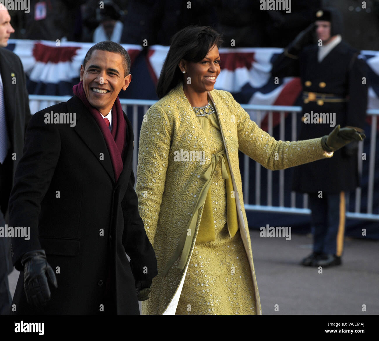 U.S. President Barack Obama walks with First Lady Michelle Obama along ...
