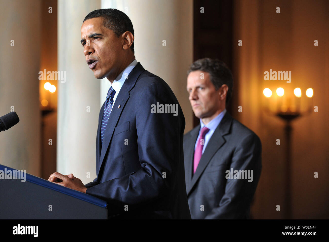 President Barack Obama (L) delivers remarks on executive compensation ...