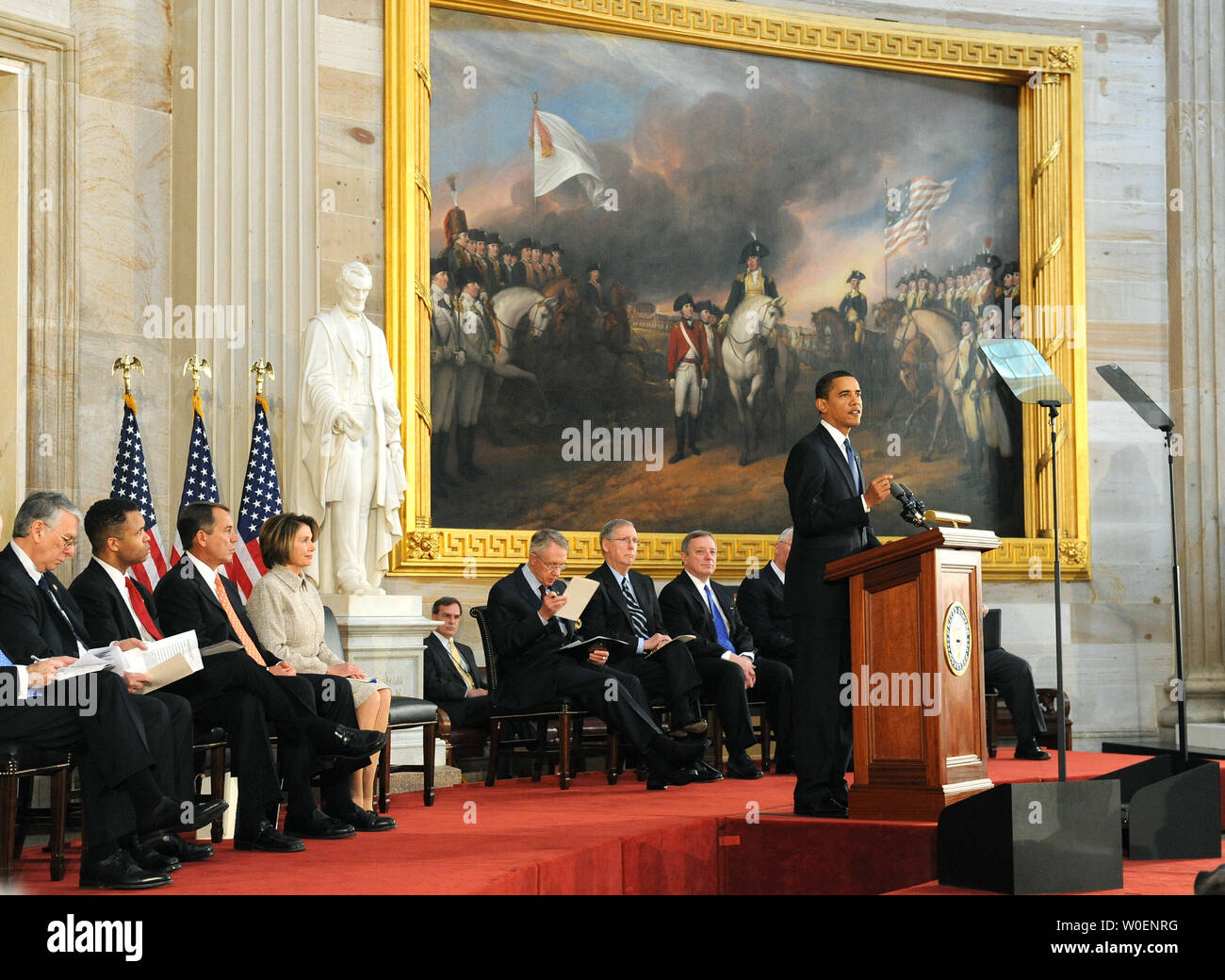 President Barack Obama, standing near a statue of Abraham Lincoln and ...