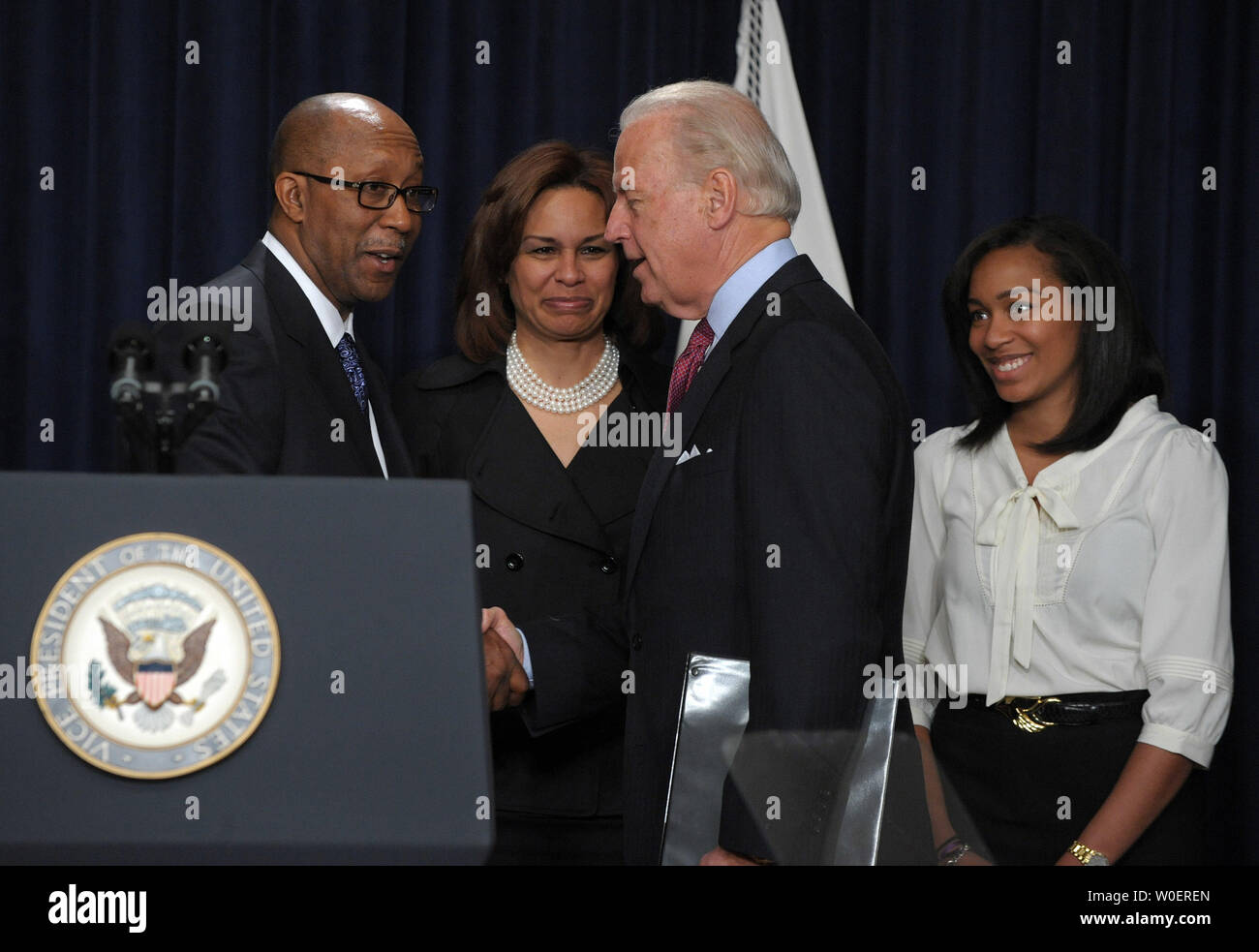U.S. Trade Representative Ron Kirk shakes hands with Vice President Joe ...