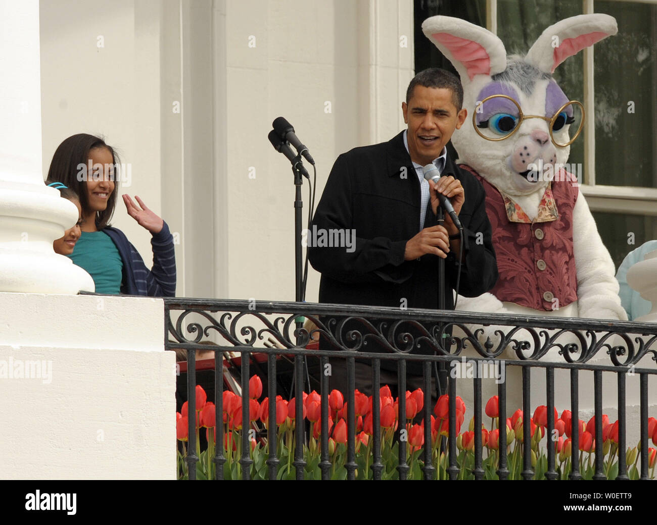 U.S. President Barack Obama prepares to speak as the Easter Bunny looks ...