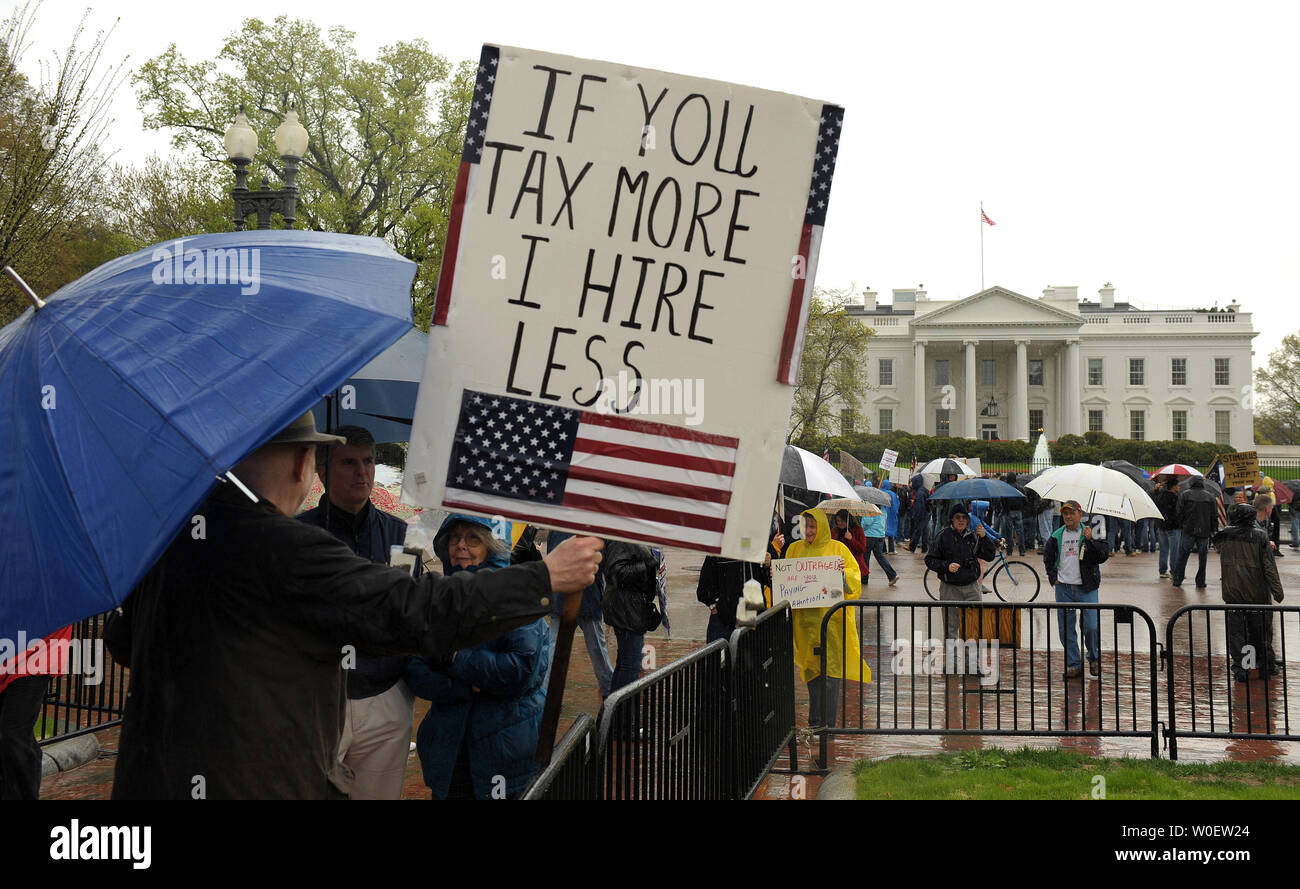 Anti-tax protesters hold a "TEA Party," which stands for "Taxed Enough ...