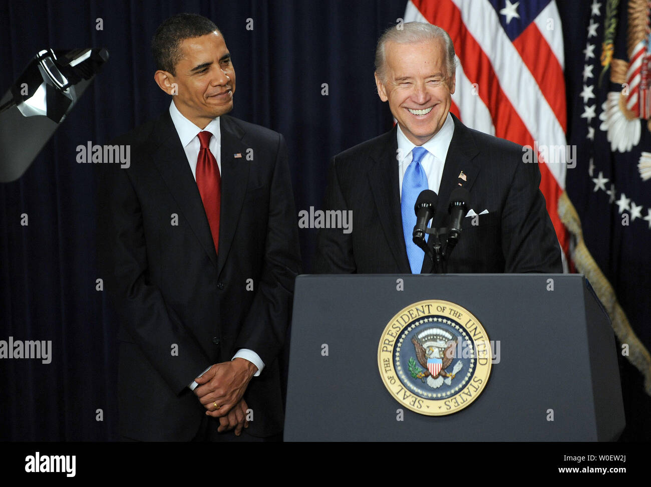 U.S. President Barack Obama listens as Vice President Joe Biden ...