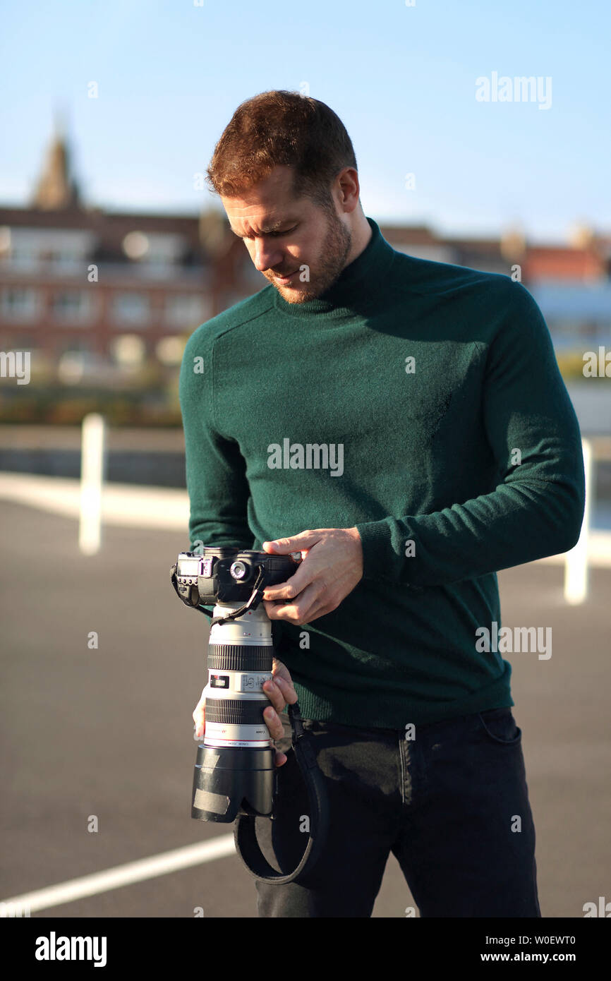 Professional photographer outside Stock Photo - Alamy