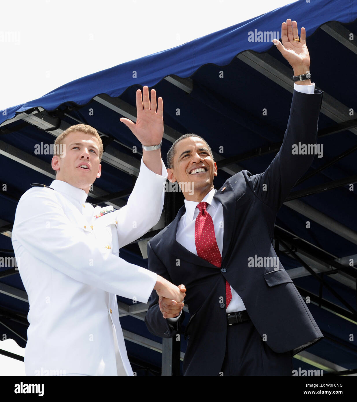 U.S. President Barack Obama shakes hands with graduate Jake Yeager ...