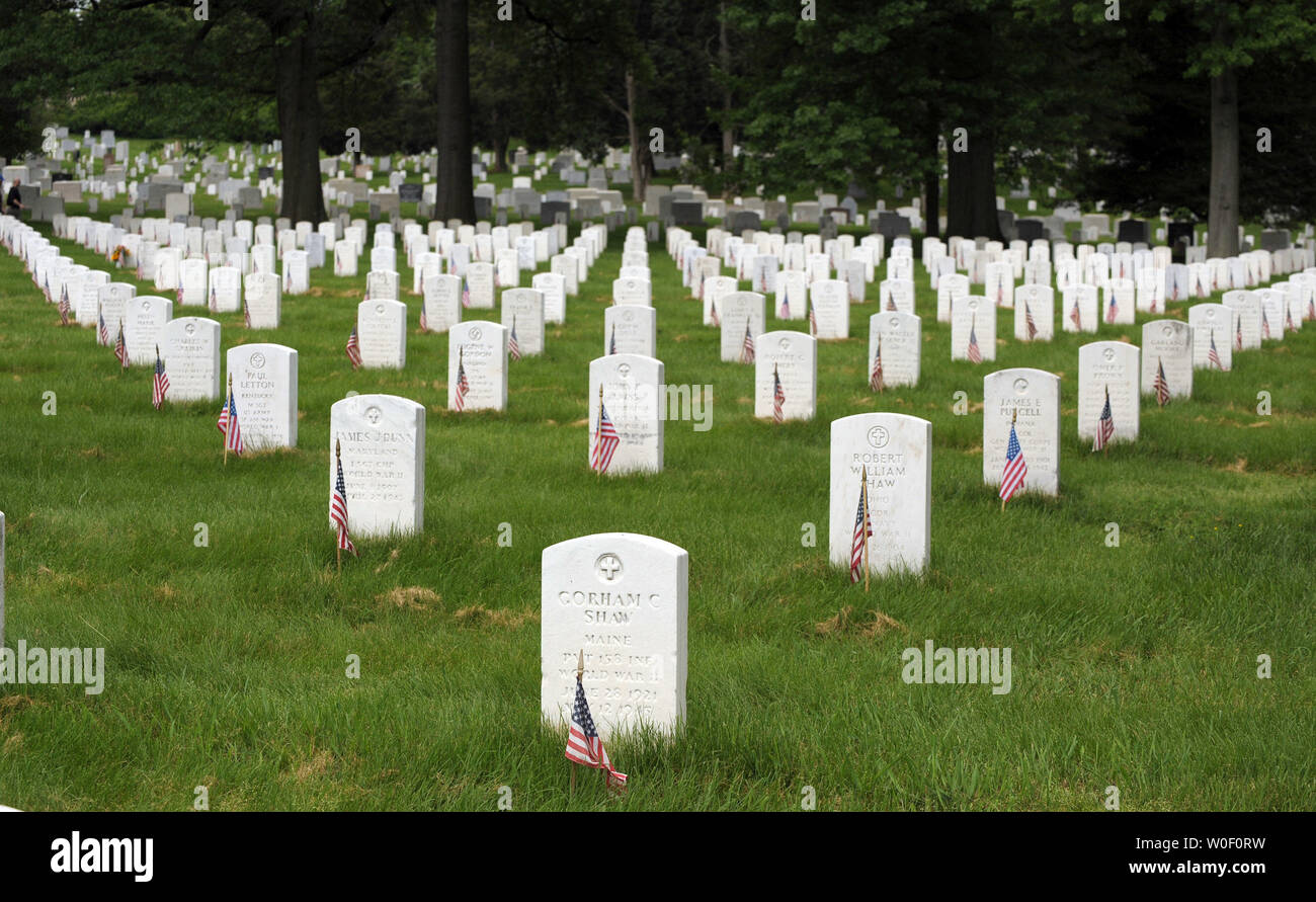 American Flags are seen in front of each grave at Arlington National ...