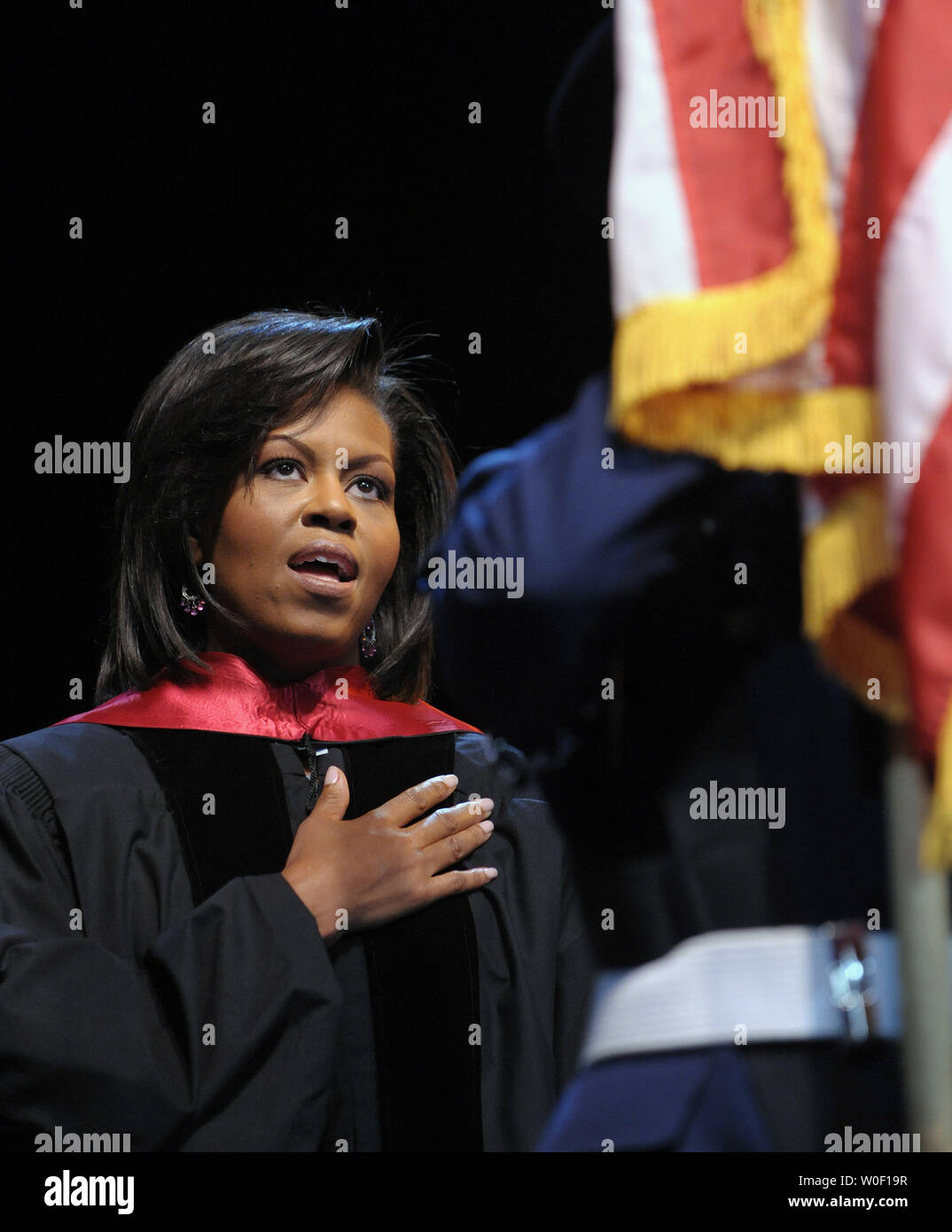 First Lady Michelle Obama signs along with the National Anthem during ...
