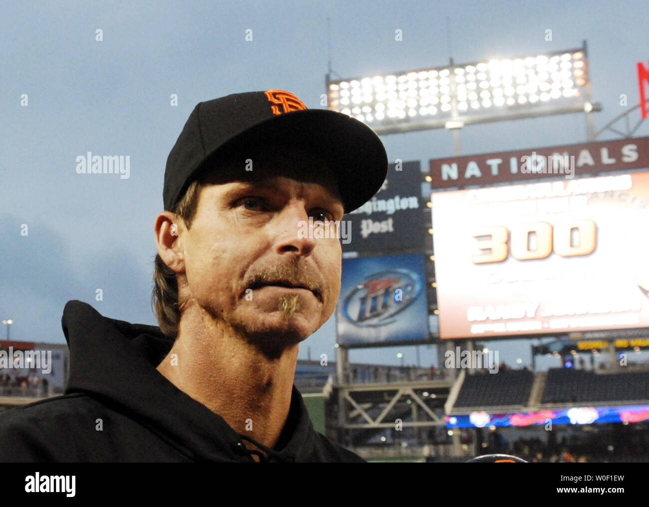 San Francisco Giants pitcher Randy Johnson stands on the field after he ...