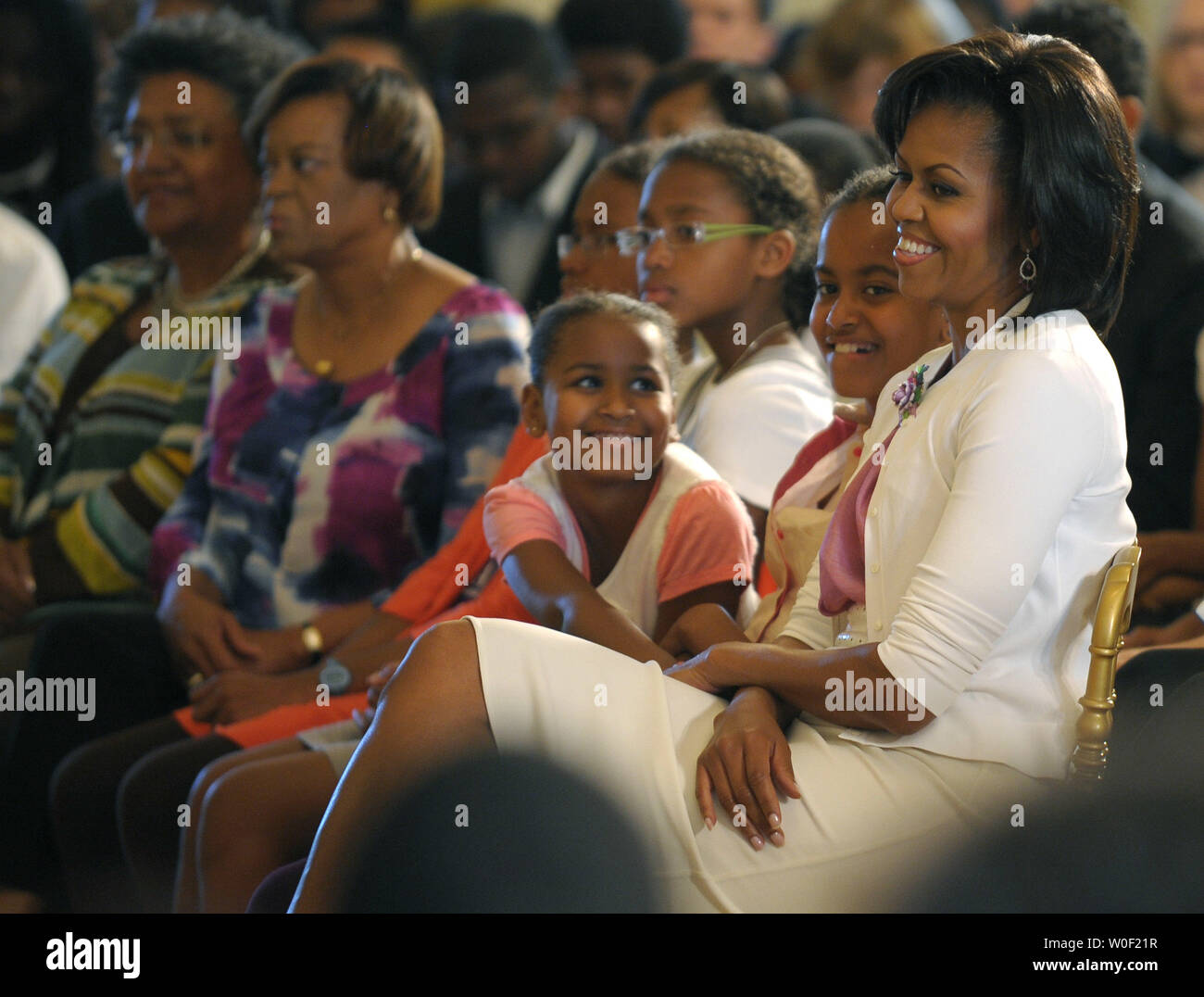 The First Lady Michelle Obama and her daughters Malia and Sasha watch ...