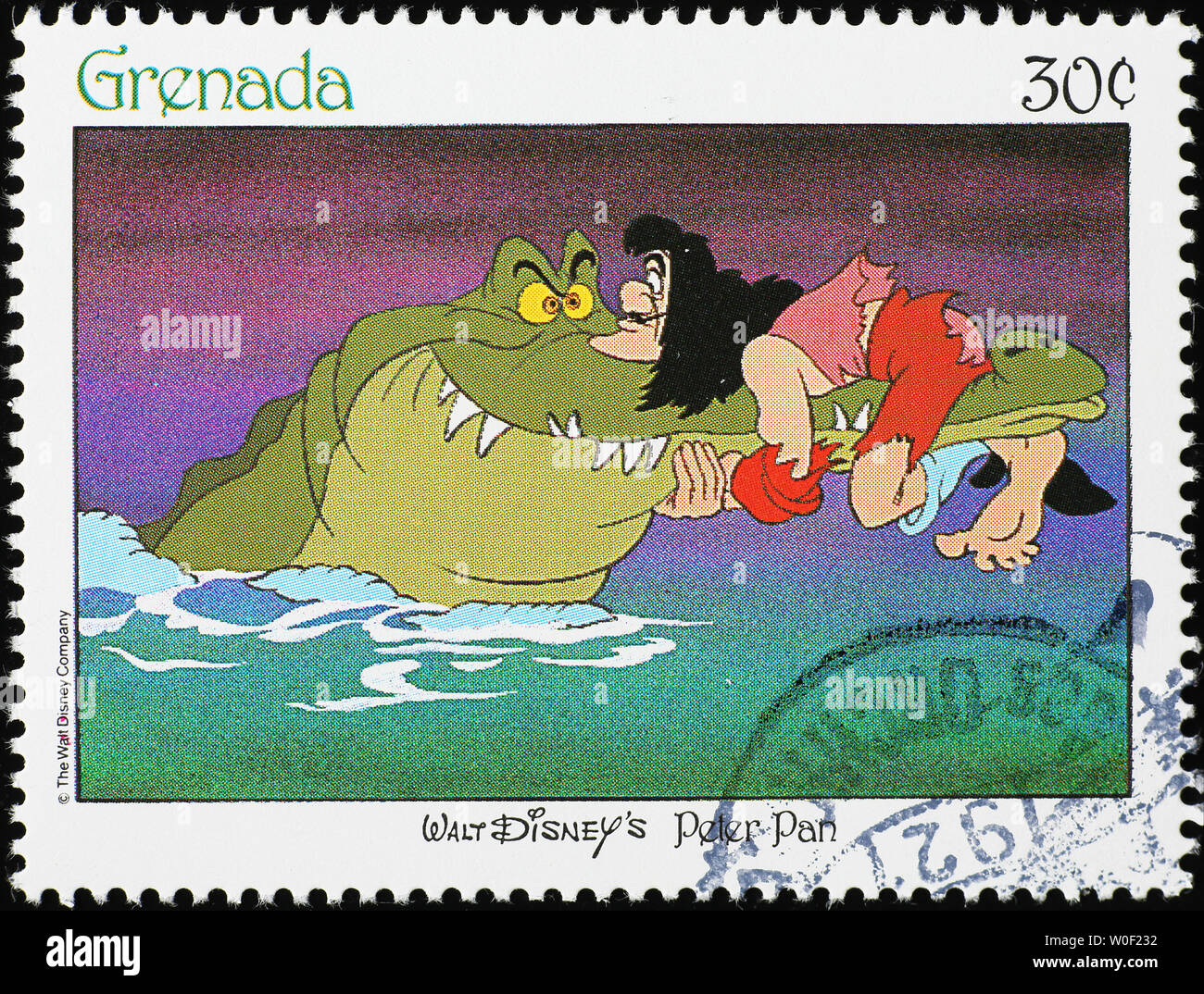 Hook tries to escape the crocodile on postage stamp Stock Photo - Alamy