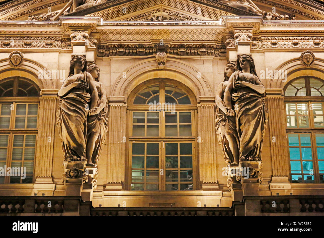 Paris. 1st district. Louvre Museum by night. Square courtyard. Facade ...