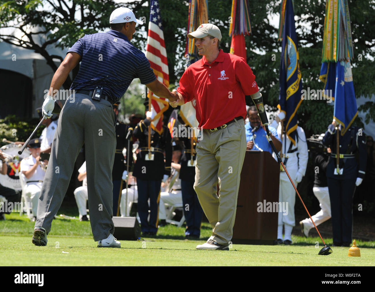 Tiger Woods shakes hands with Wounded Warrior Major Ken Dwyer after ...