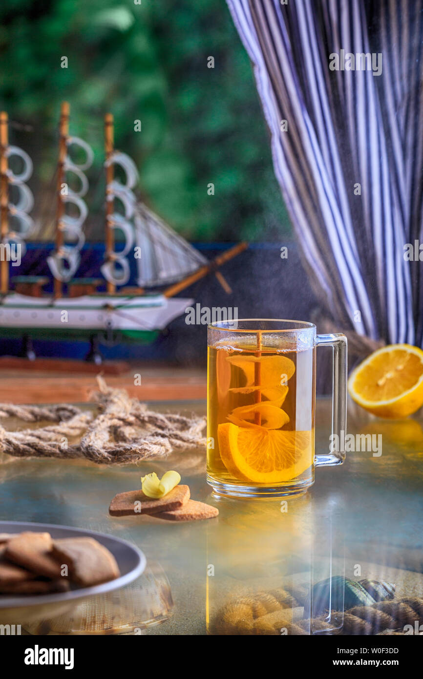 cup of tea with ship inside concept sea ill lemon ginger cookies Stock ...