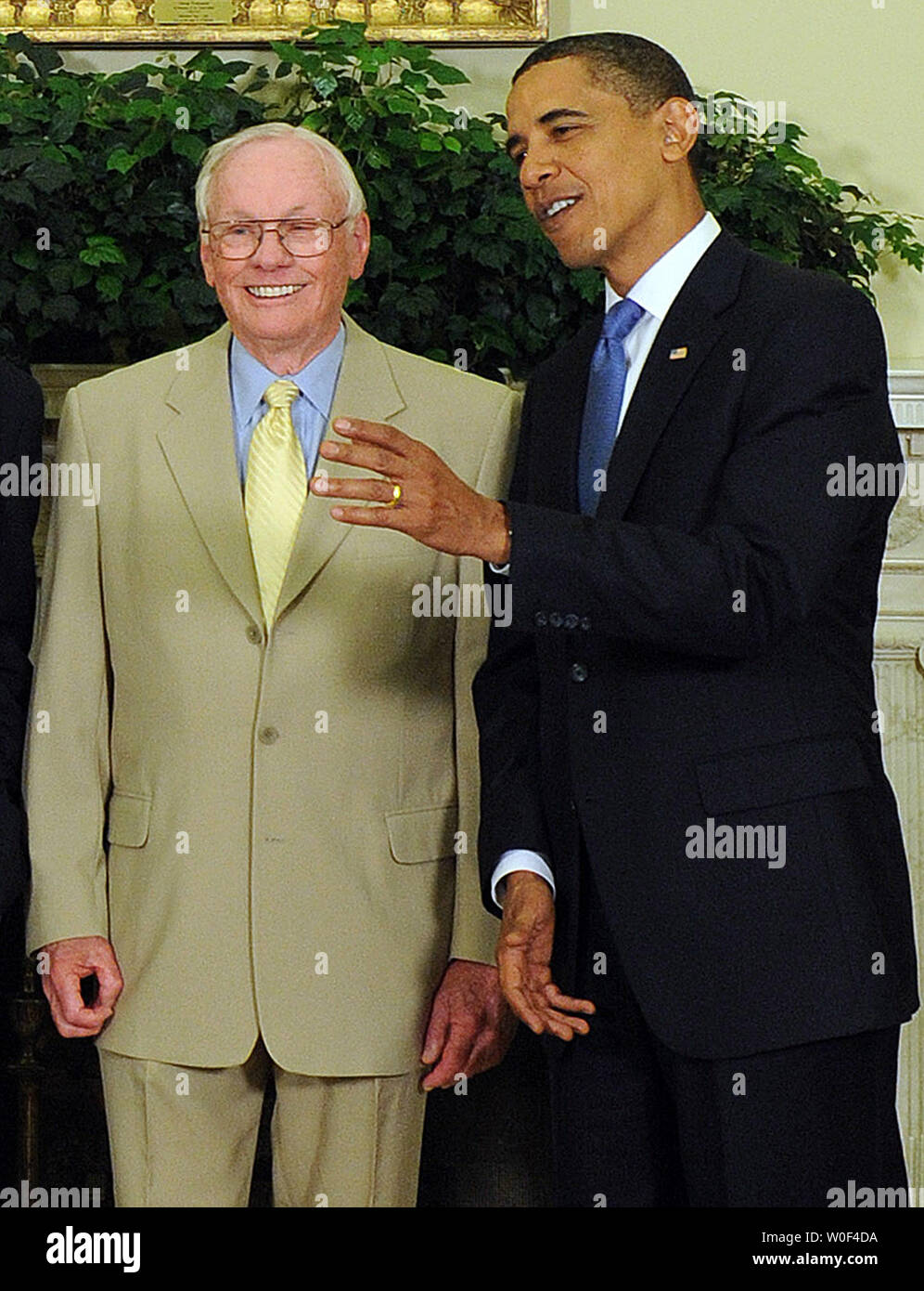 U.S. President Barack Obama stands with Neil Armstrong, the first man ...