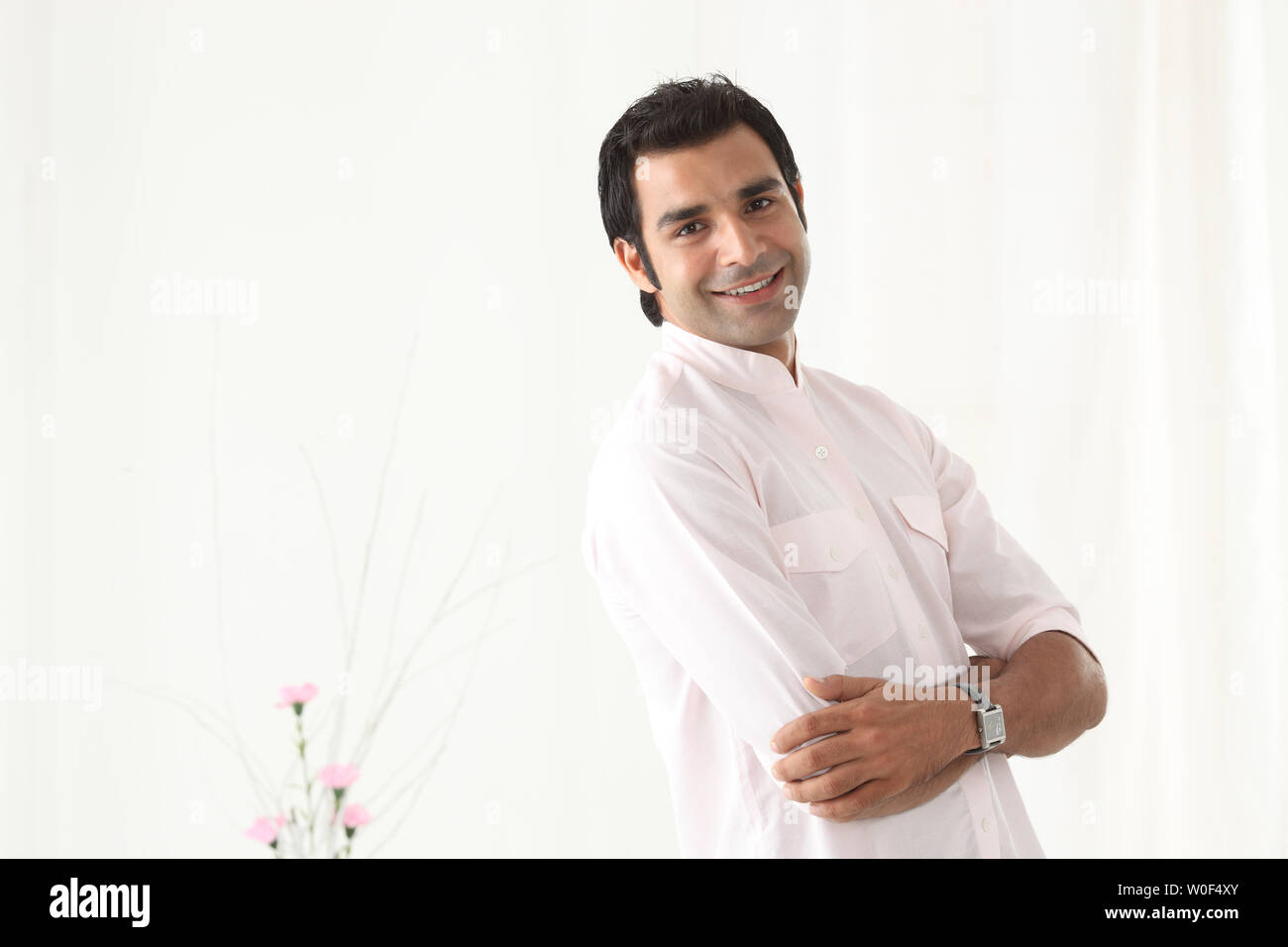 Portrait of an Indian young man smiling Stock Photo - Alamy