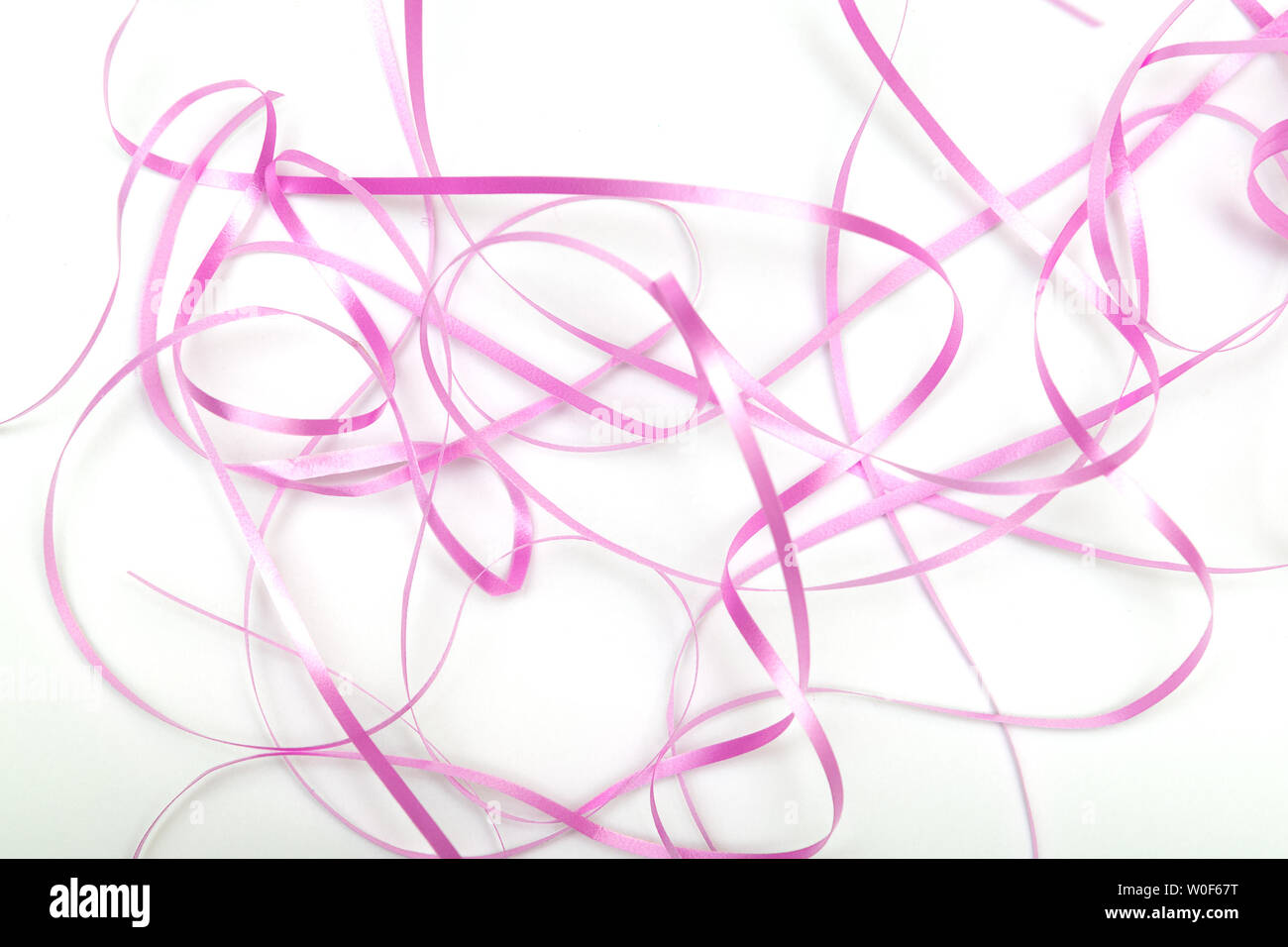 Pink thin ribbon, isolated on white background Stock Photo - Alamy