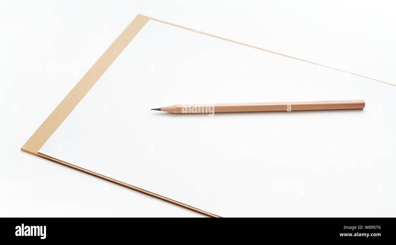 A pencil on white paper Stock Photo - Alamy