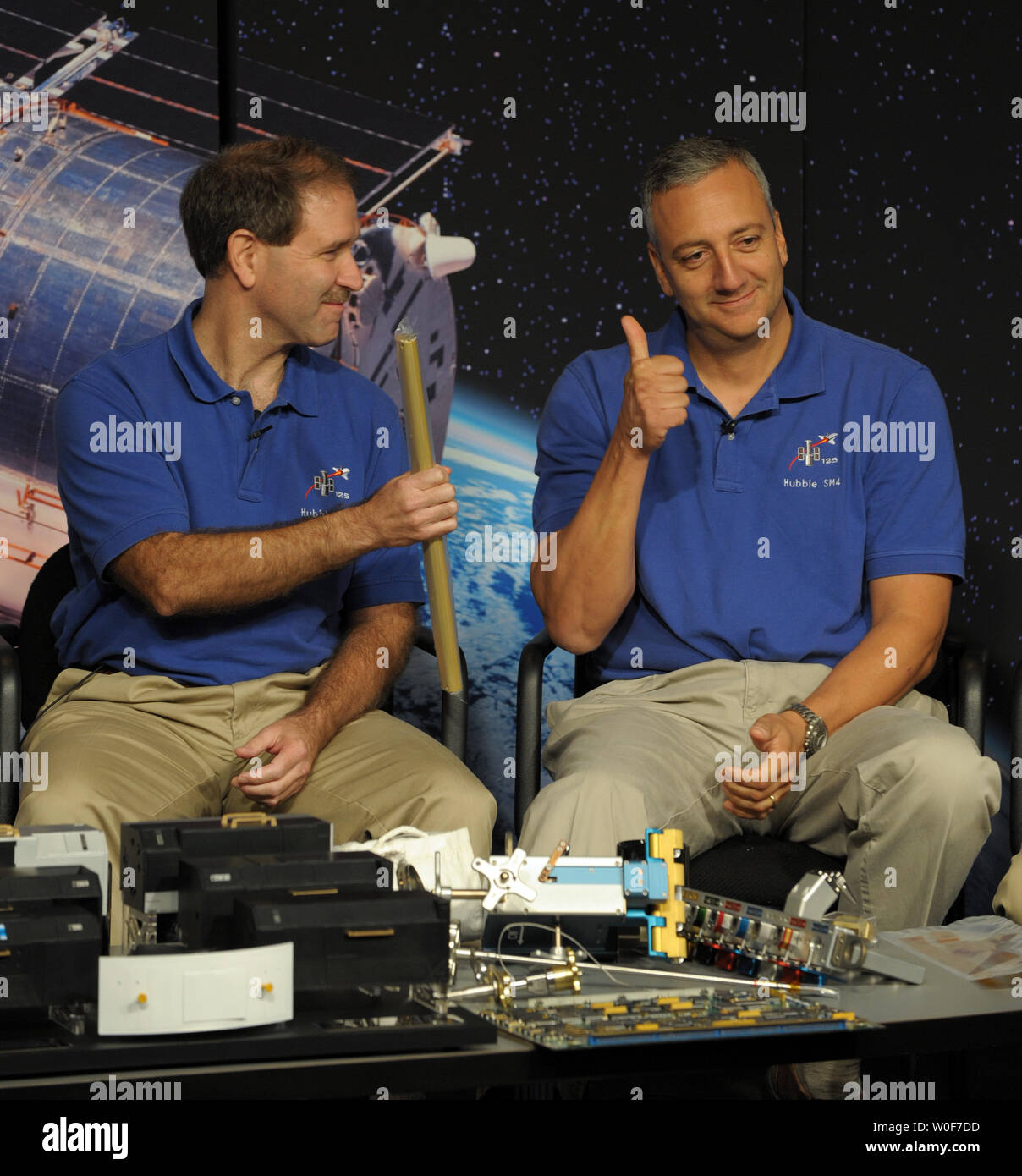 Astronauts John Grunsfeld (L) and Mike Massamino discuss Space Shuttle ...