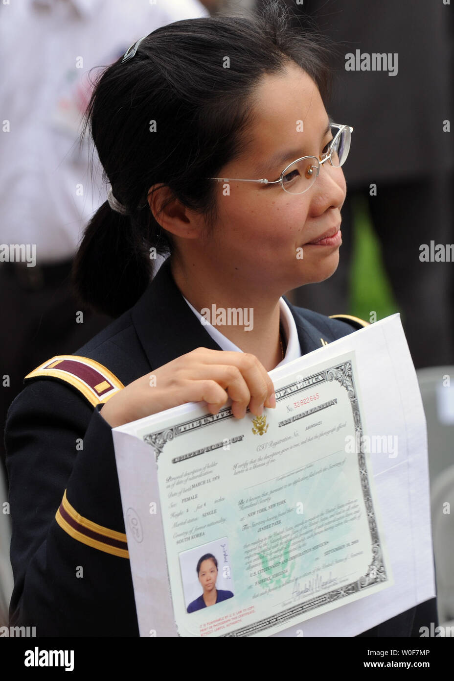 Jinhee Park, of South Korea, holds her Certificate of Naturalization ...