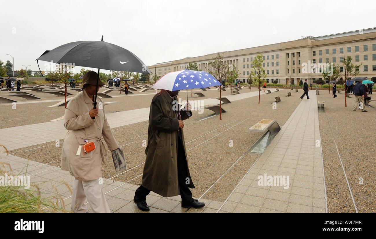 Family members of victims walk through the Pentagon's 9-11 Memorial ...