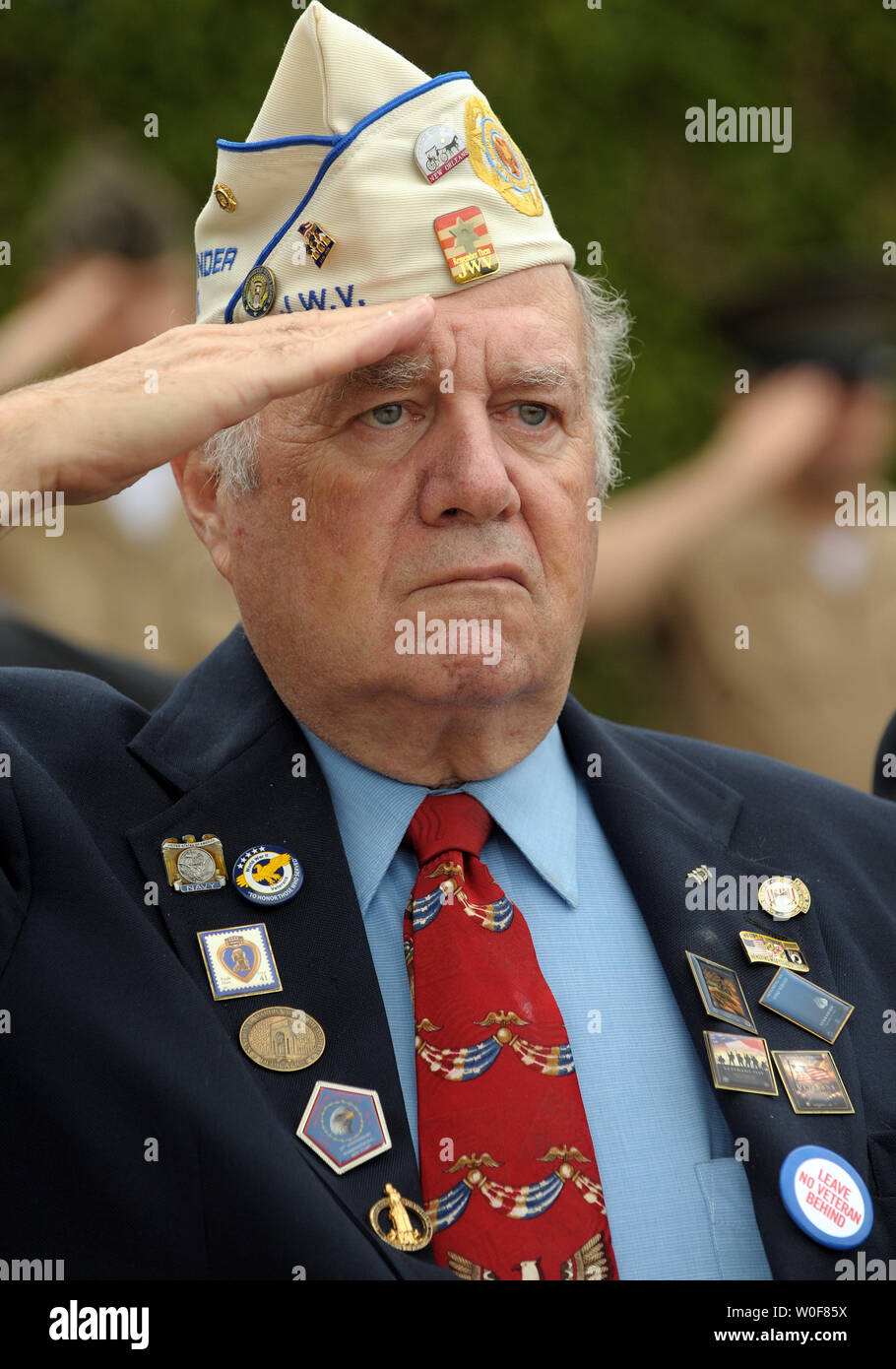 Veteran Richard Rosenzweig salutes during the Pentagon ceremony for ...