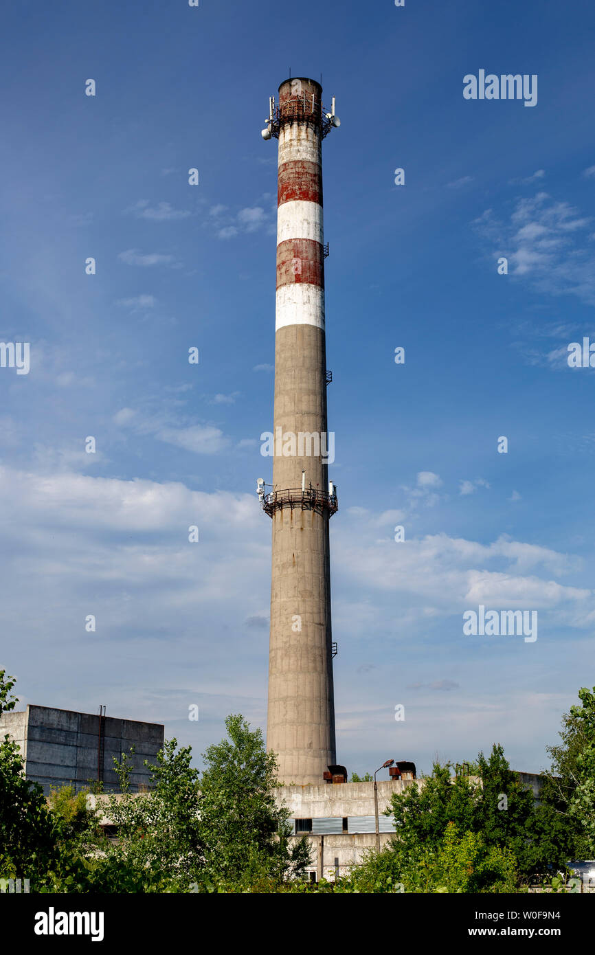 Chimneys of an old factory. Pipes for air emissions. Communication ...