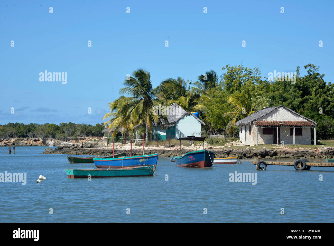 Cuba, Gibara, the small harbor of San Antonio in front of Gibara, blue ...