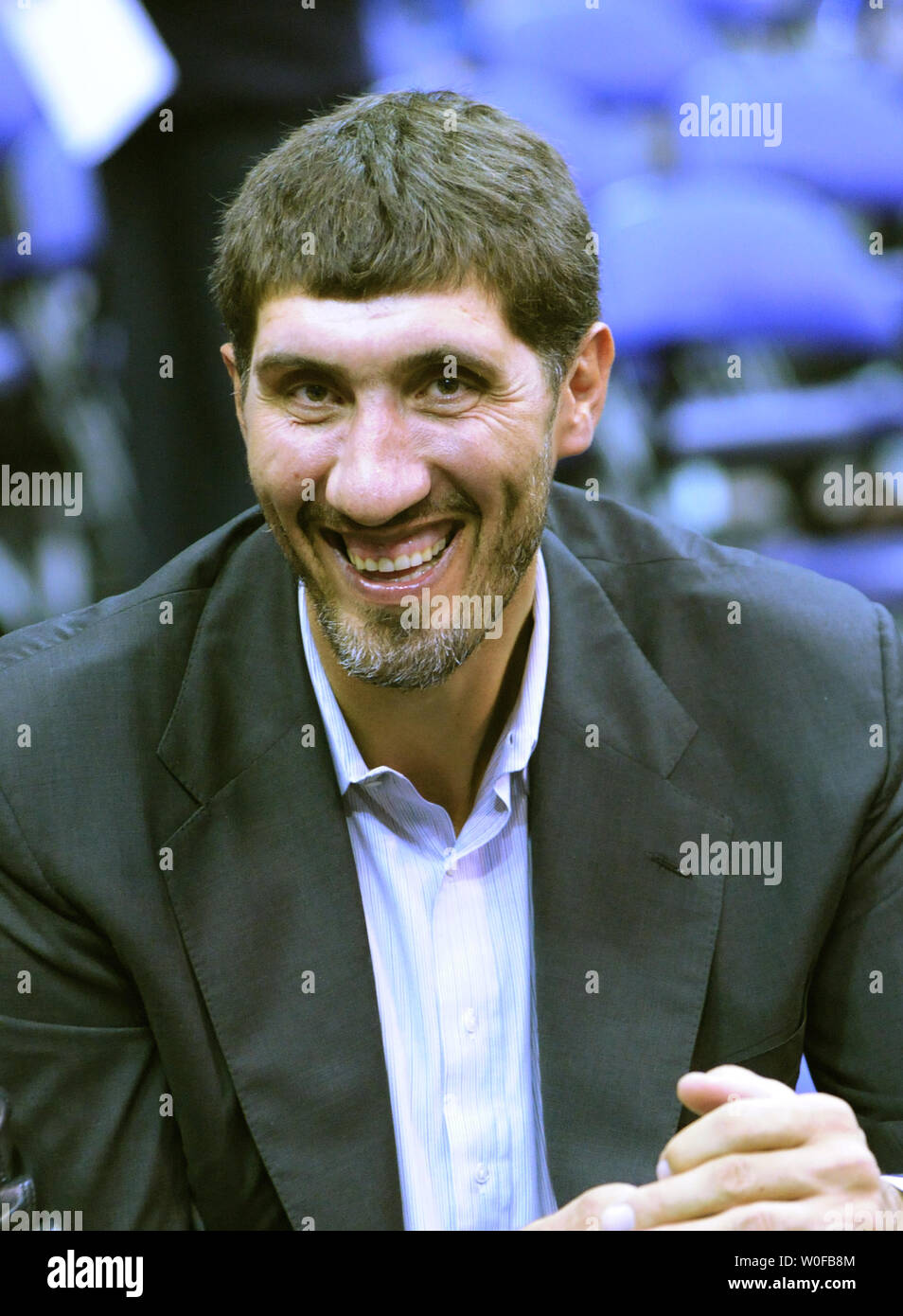 Former NBA player George Mureşan attends a game between the Detroit ...