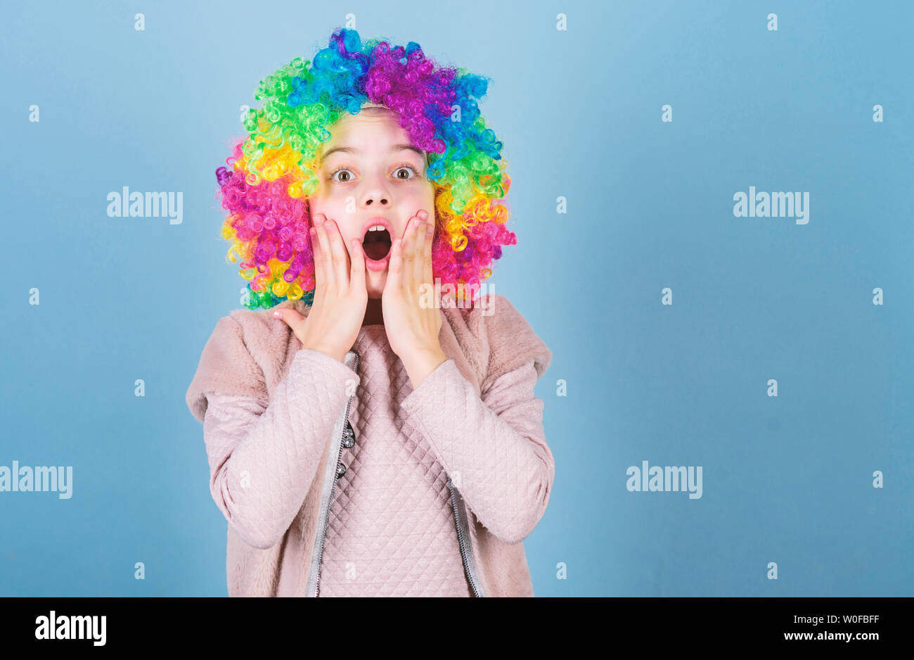 Keep your eyes for a surprise. Cute small girl opened mouth with big ...