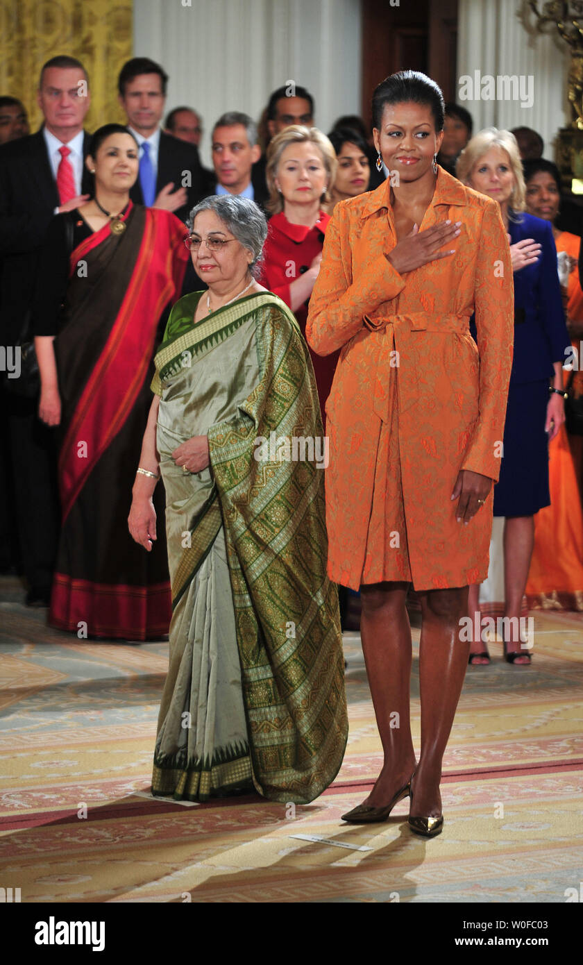 First Lady Michelle Obama (R) stands with India's First Lady Gursharan ...