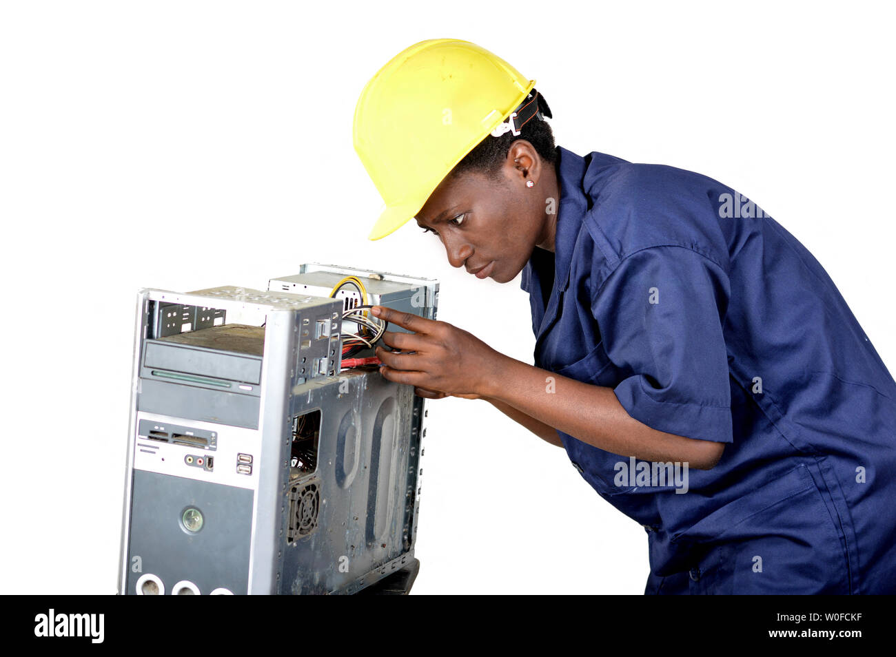 Computer maintenance technician tests the electrical circuits of the ...