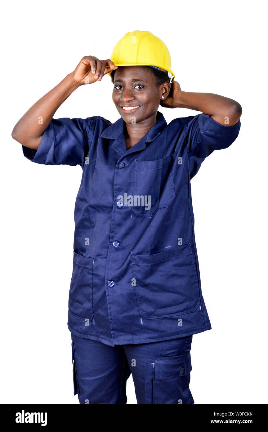 Construction worker wearing her helmet and smiling on a white ...