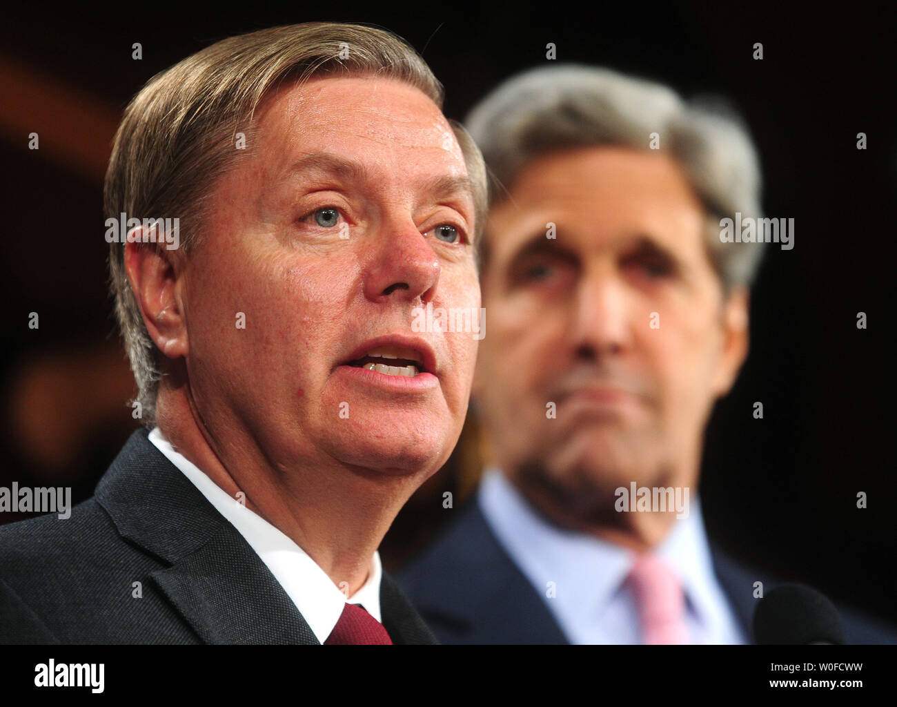 Sen. Lindsey Graham (R-SC) (L) speaks on climate change alongside Sen ...