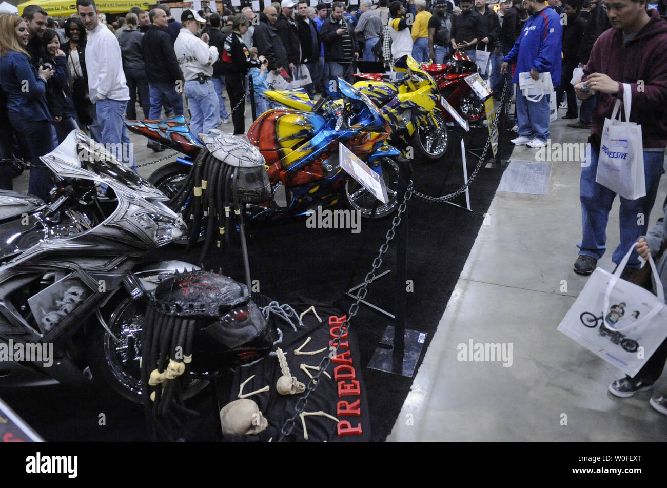 People look at customized motorcycles at the 29th Annual Cycle World ...