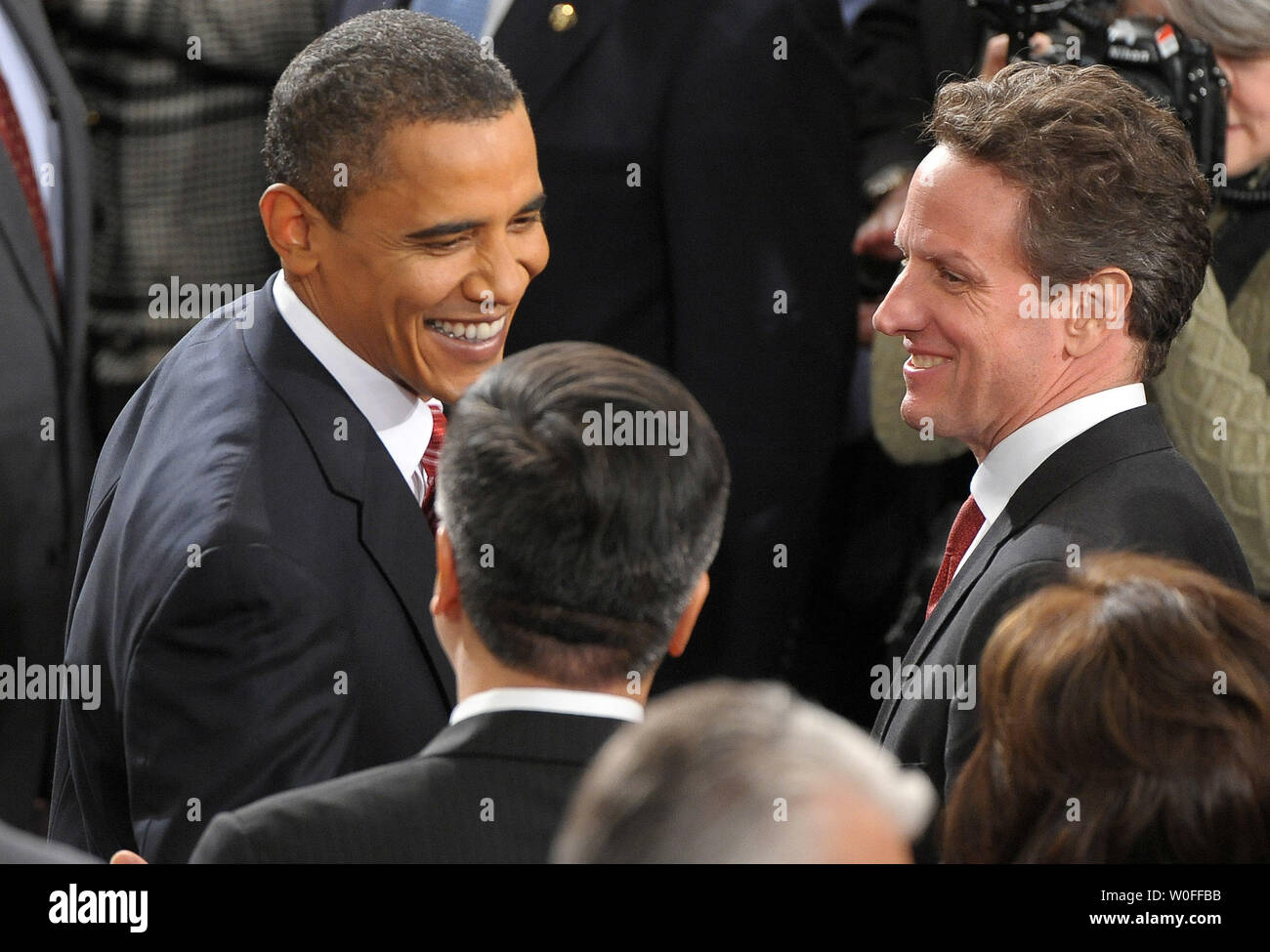 U.S. President Barack Obama greets Treasury Secretary Timothy Geithner ...