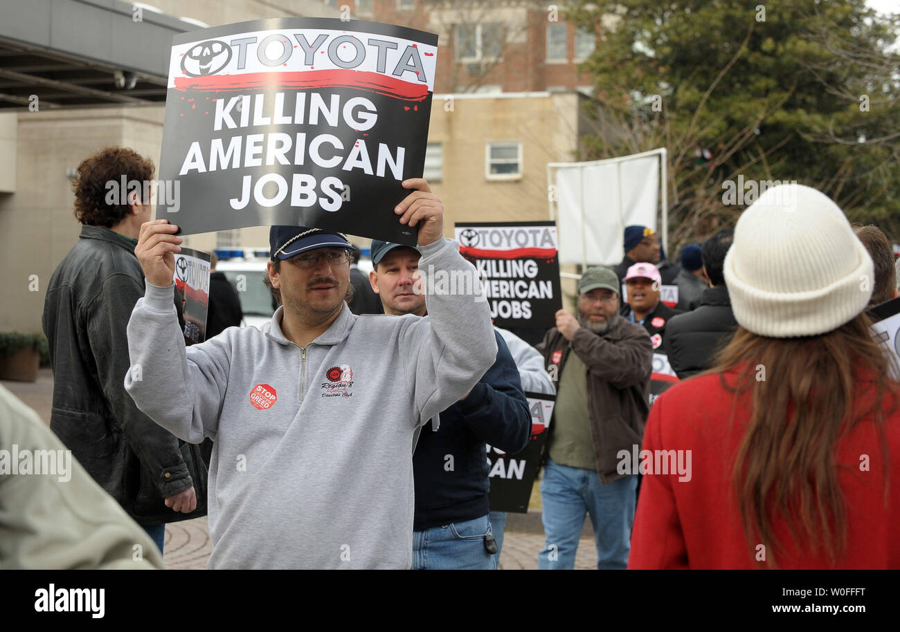 Demonstrators protest auto manufacturer Toyota in front of the Japanese ...