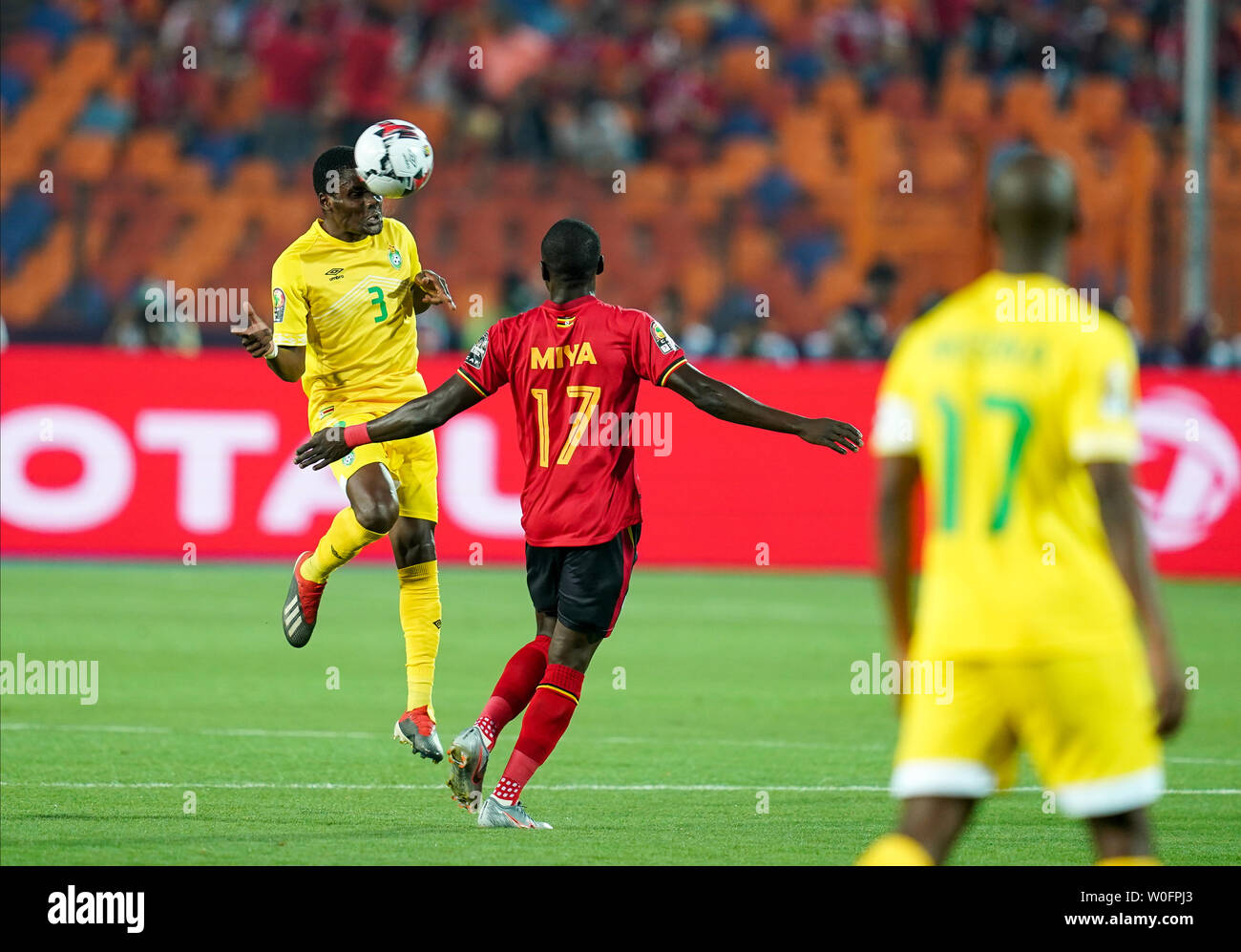 Cairo, Egypt. 26th June, 2019. Danny Phiri of Zimbabwe heading the ball ...