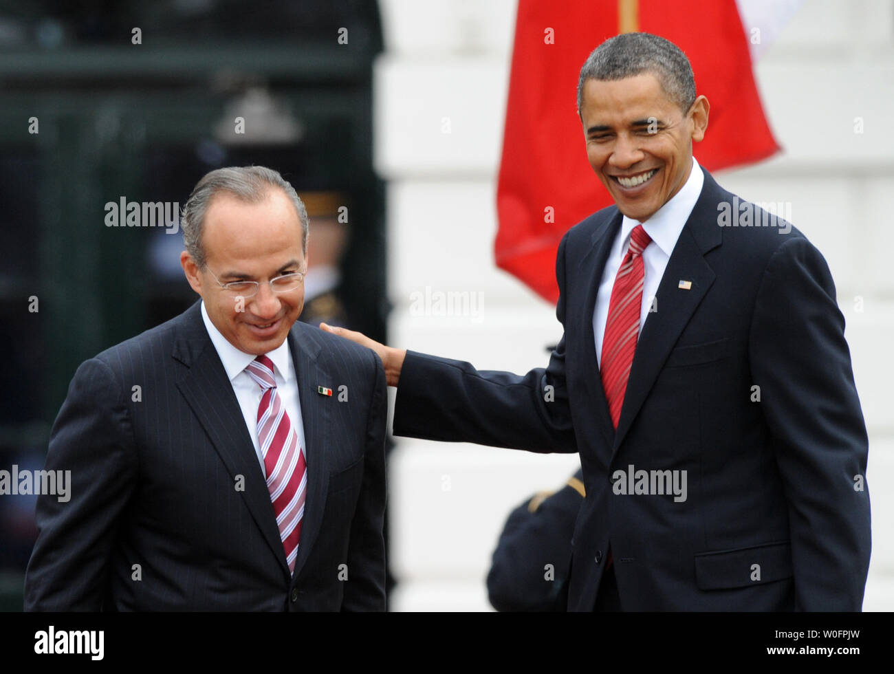 U.S. President Barack Obama (R) smiles with Mexican President Felipe ...